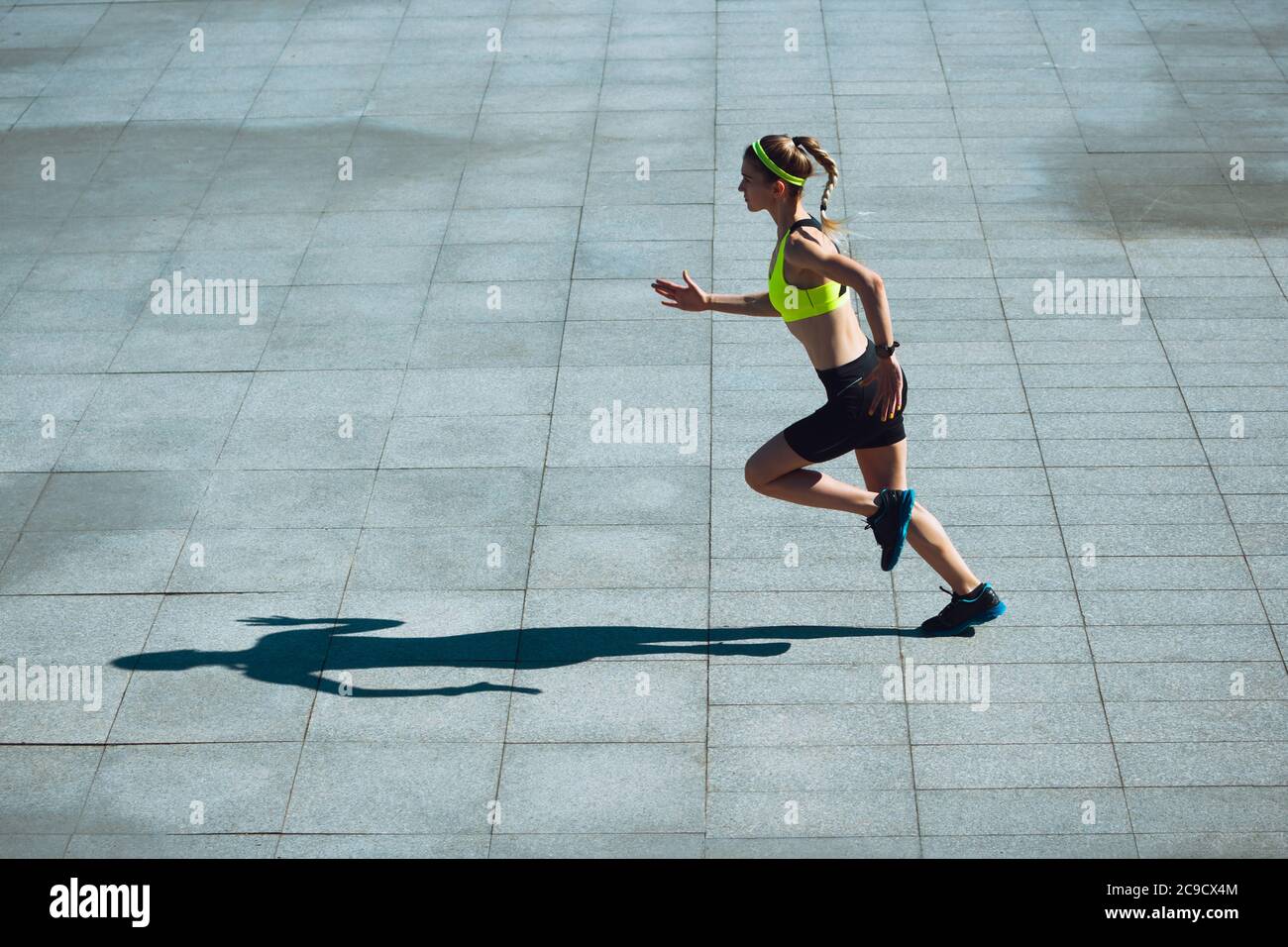 Achievement. Female runner, athlete training outdoors. Professional ...