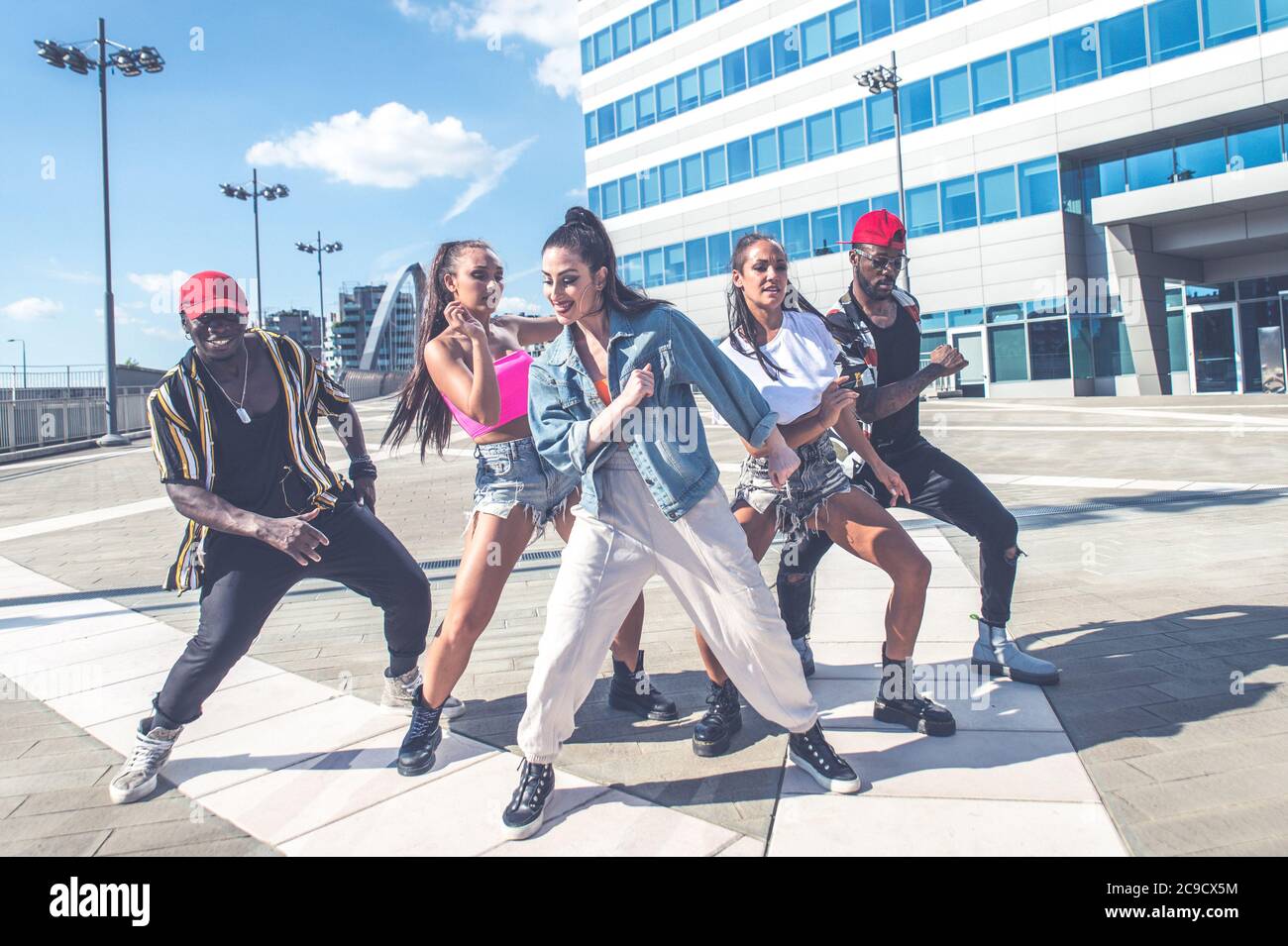 Group of hip hop dancers permorming their dance. Crew making show in an ...