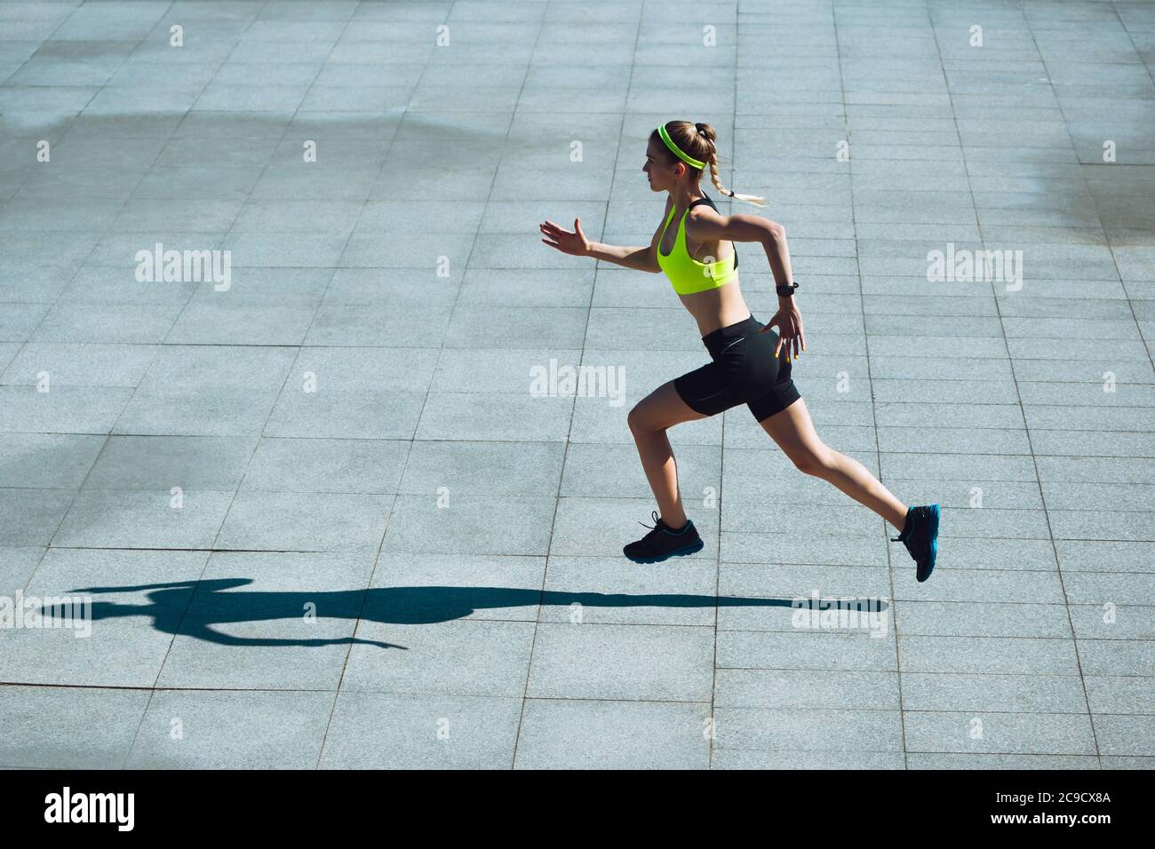 Achievement. Female runner, athlete training outdoors. Professional ...