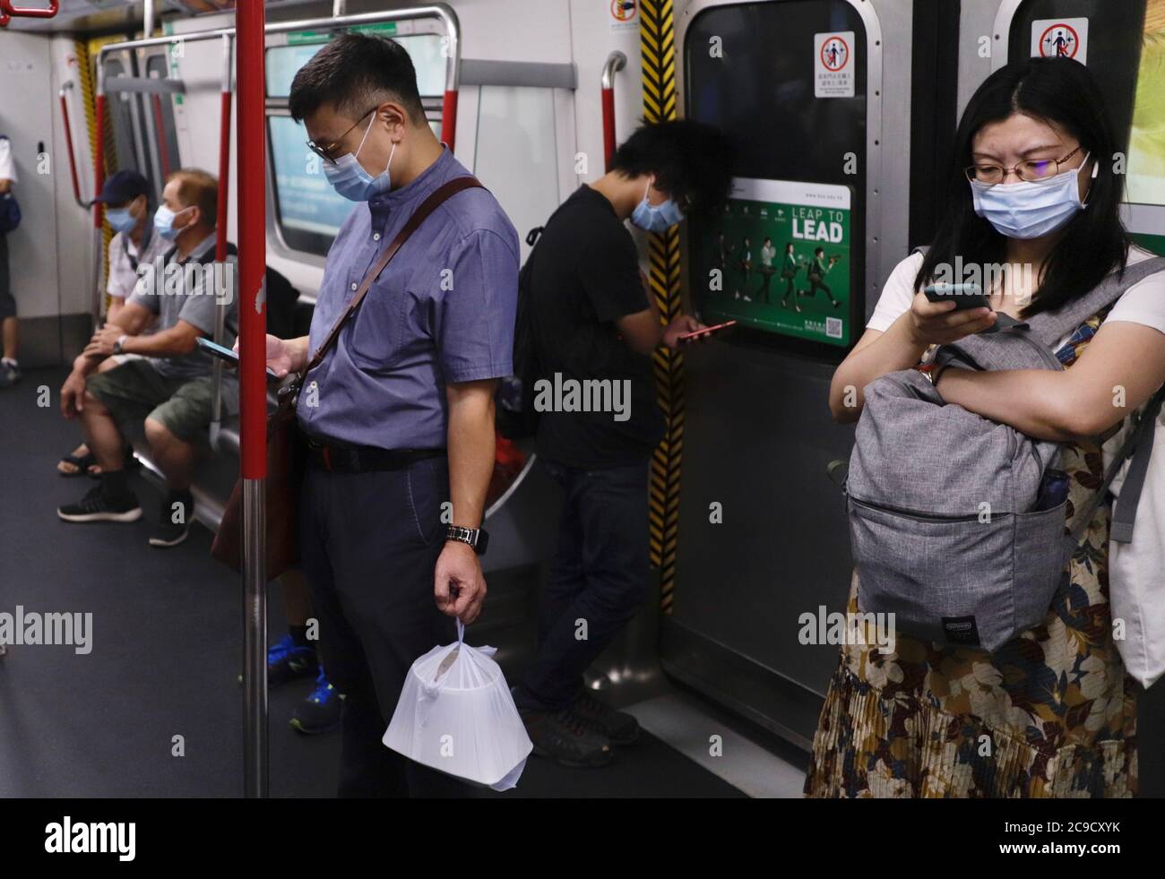 Hong Kong, CHINA. 30th July, 2020. A man carries his take-outs inside ...