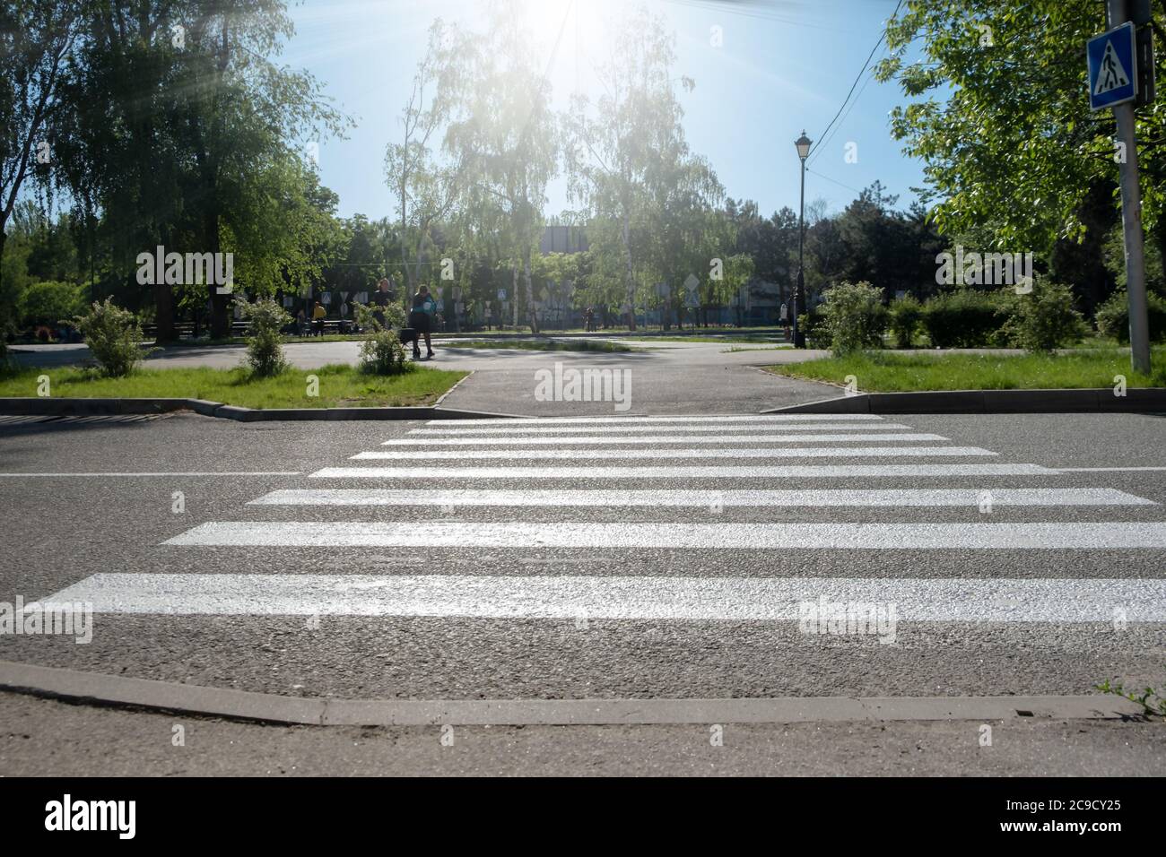 A crosswalk for pedestrians crossing the street. Empty crosswalk to the ...