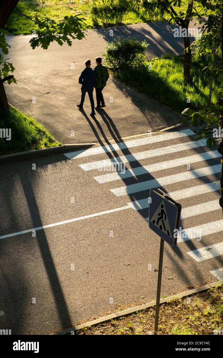 Man walking across road hi-res stock photography and images - Alamy