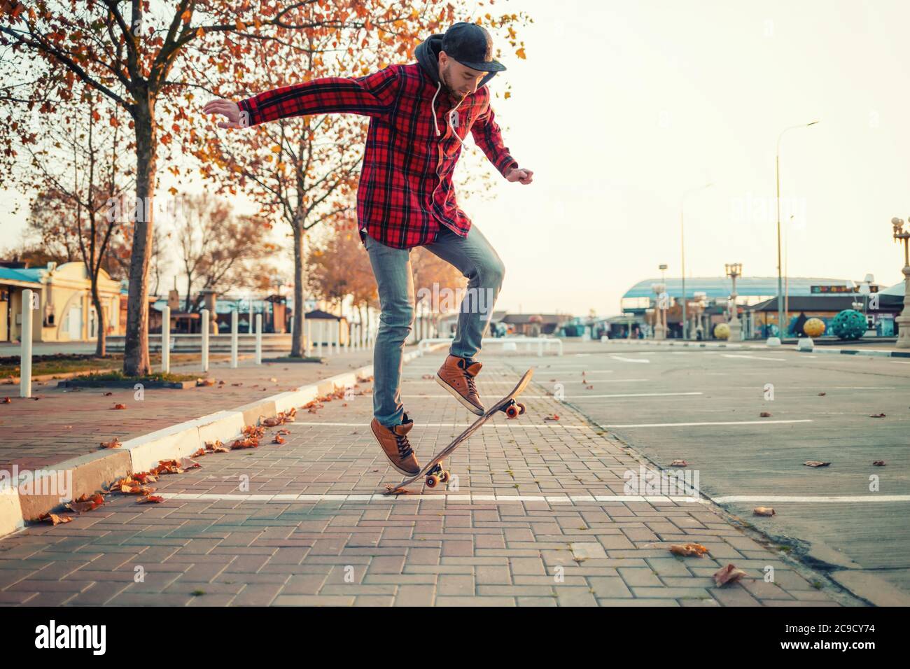 Skateboarding. A man does an Ollie stunt on a skateboard. Jump in the ...