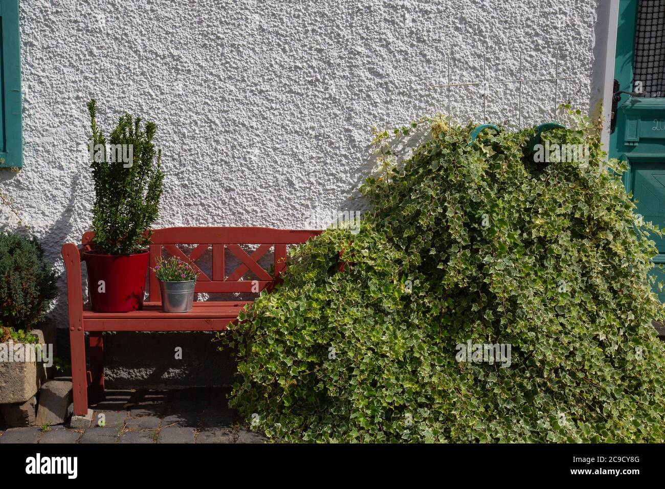 Bench in front of brick house hi-res stock photography and images - Alamy