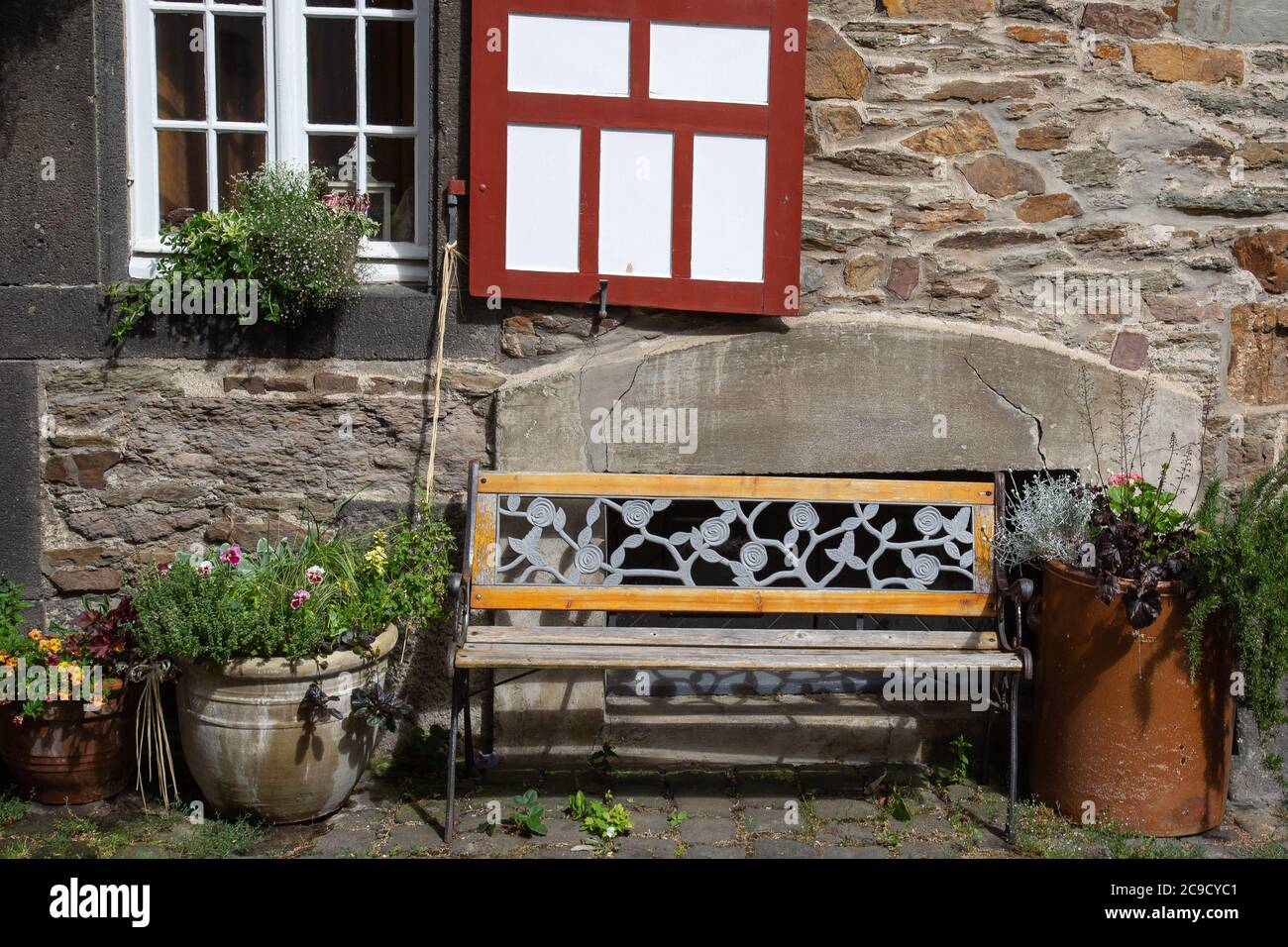 Bench in front of brick house hi-res stock photography and images - Alamy