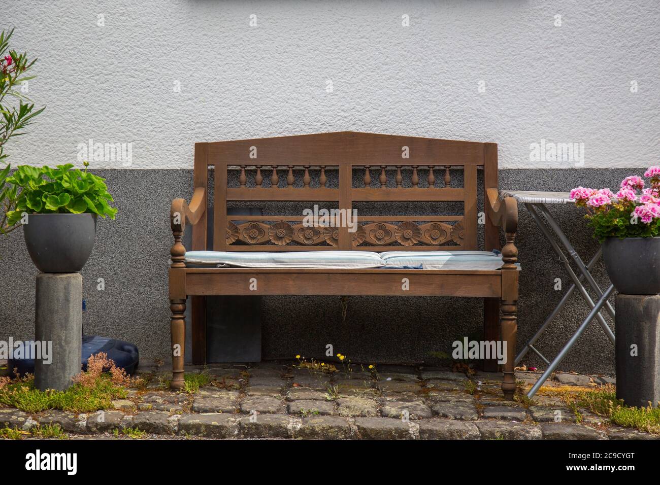 Bench in front of brick house hi-res stock photography and images - Alamy