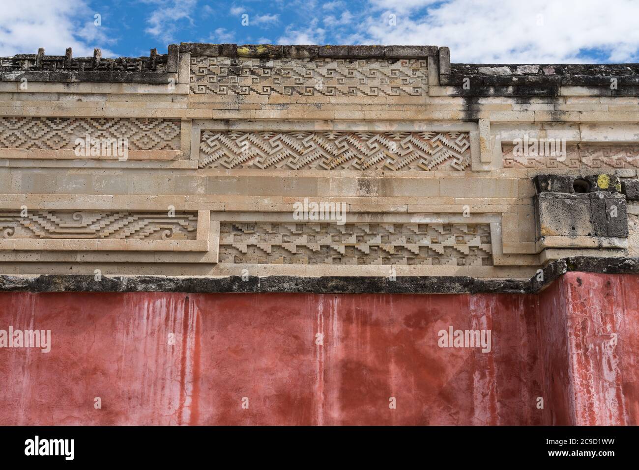 Stone fretwork panels and red stucco on the front of the Palace ...