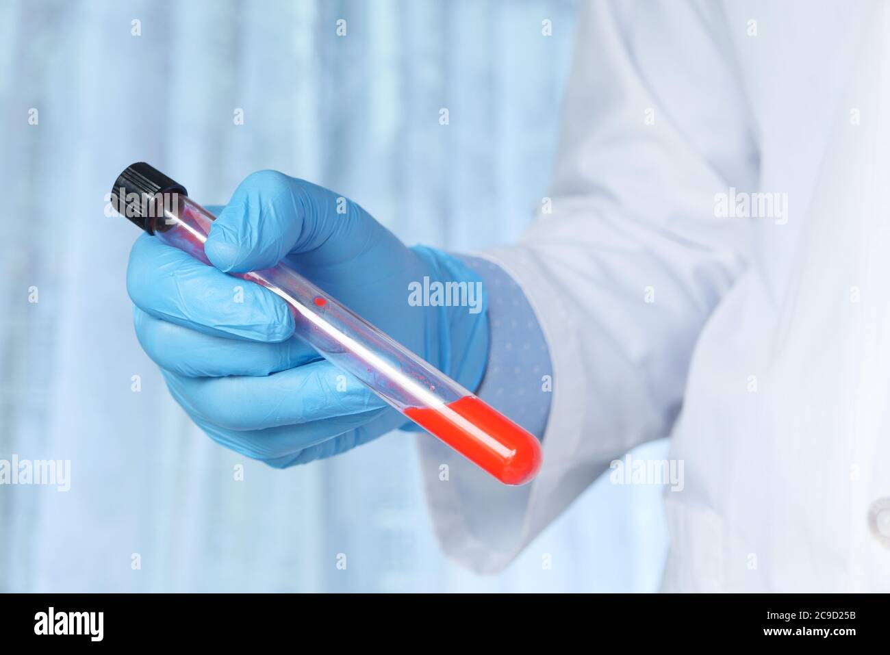 laboratory technician hand holding blood test tube Stock Photo - Alamy