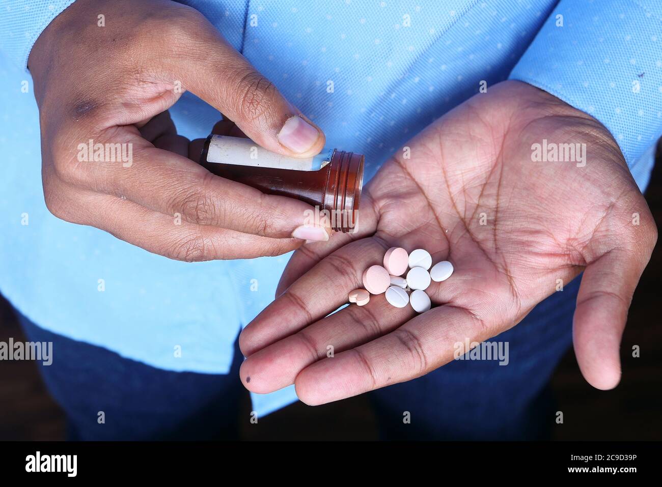 Top view of man's hands taking medicine Stock Photo - Alamy