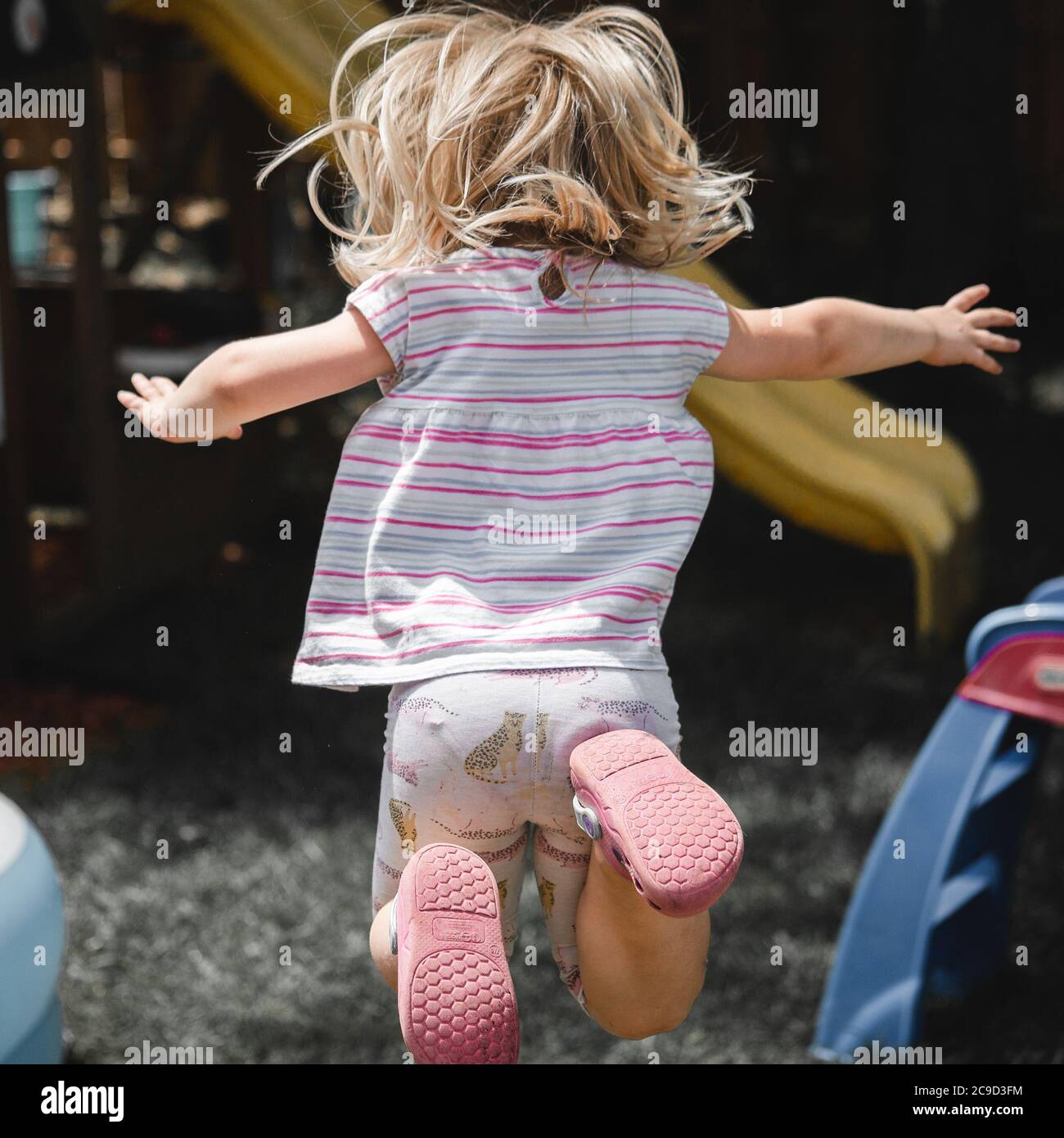 Kid girl jumping energetic hi-res stock photography and images - Alamy