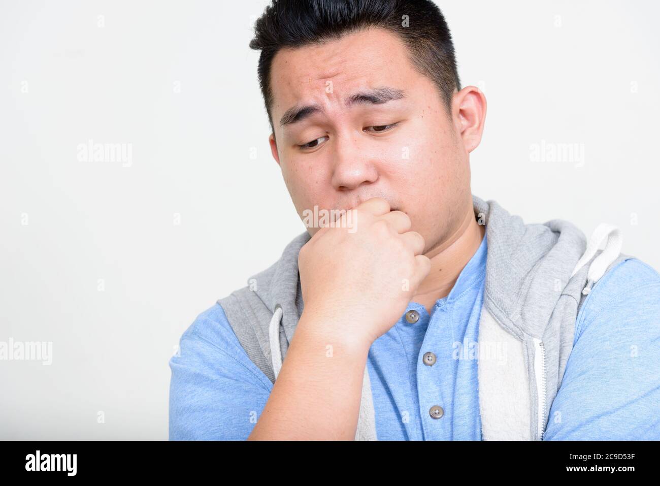 Worried overweight young man looking hi-res stock photography and ...