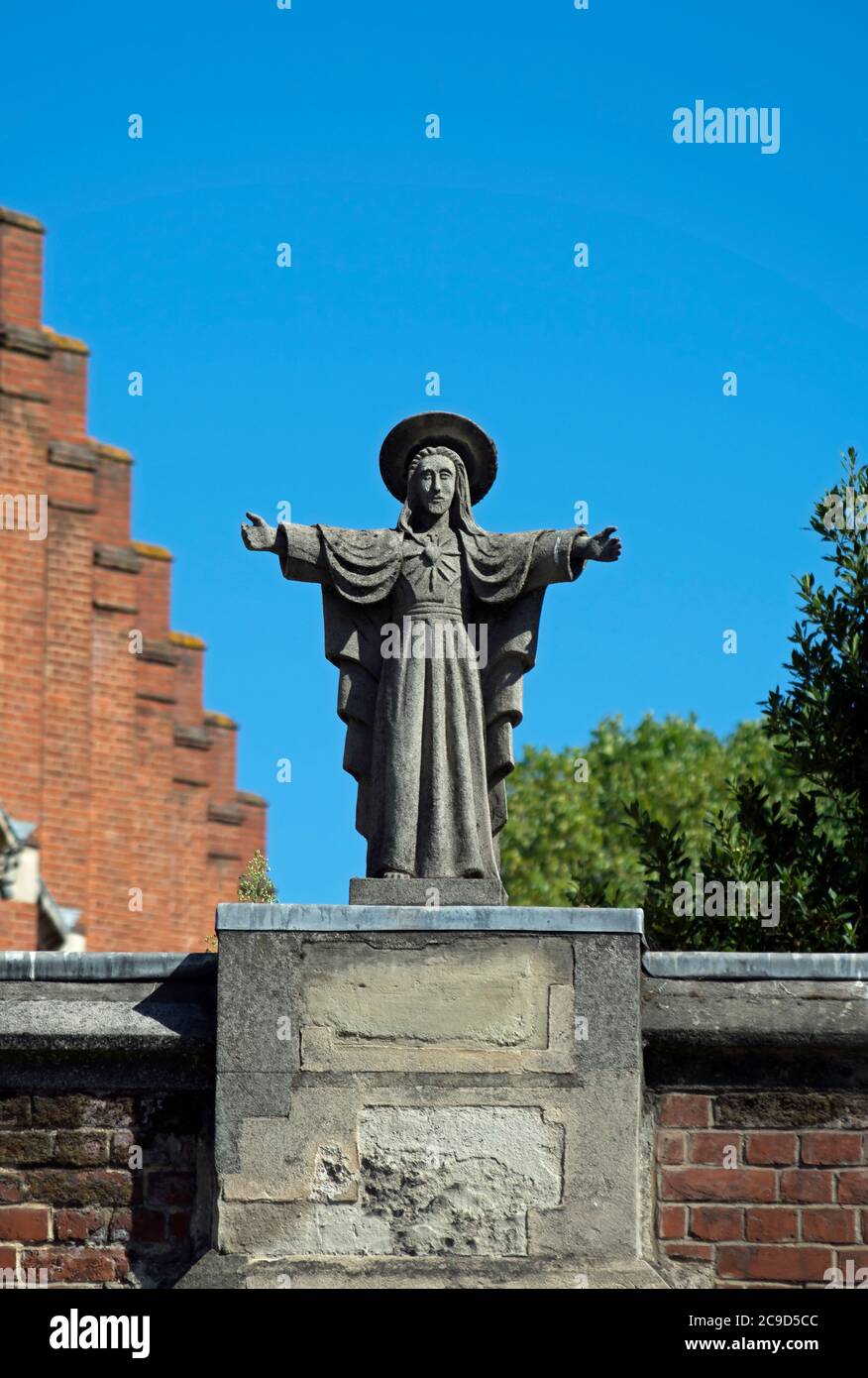 statue of jesus christ above an entrance to the sacred heart high ...