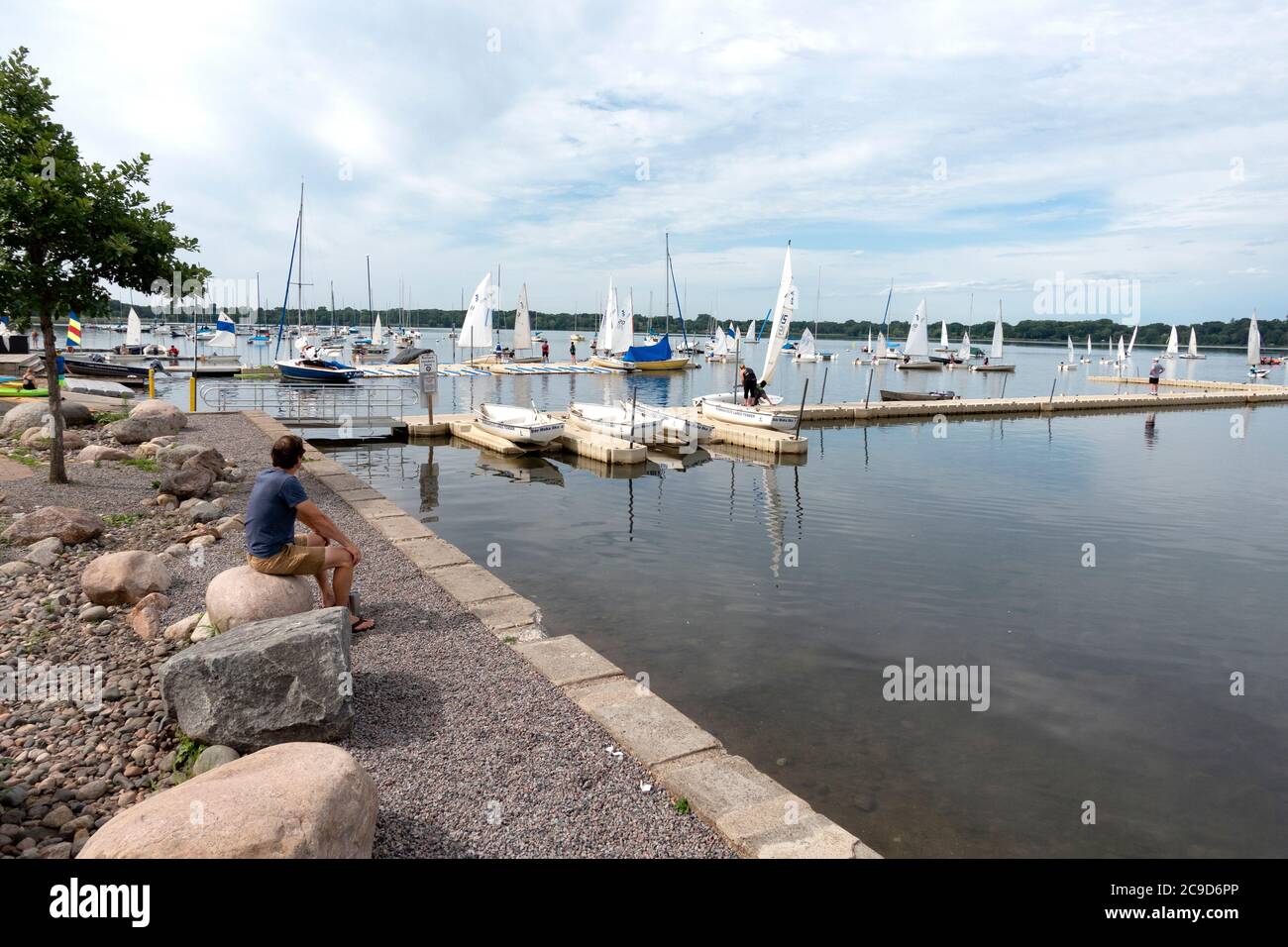 Lake Bde Maka Ska (was Lake Calhoun) with many sailboats and person ...