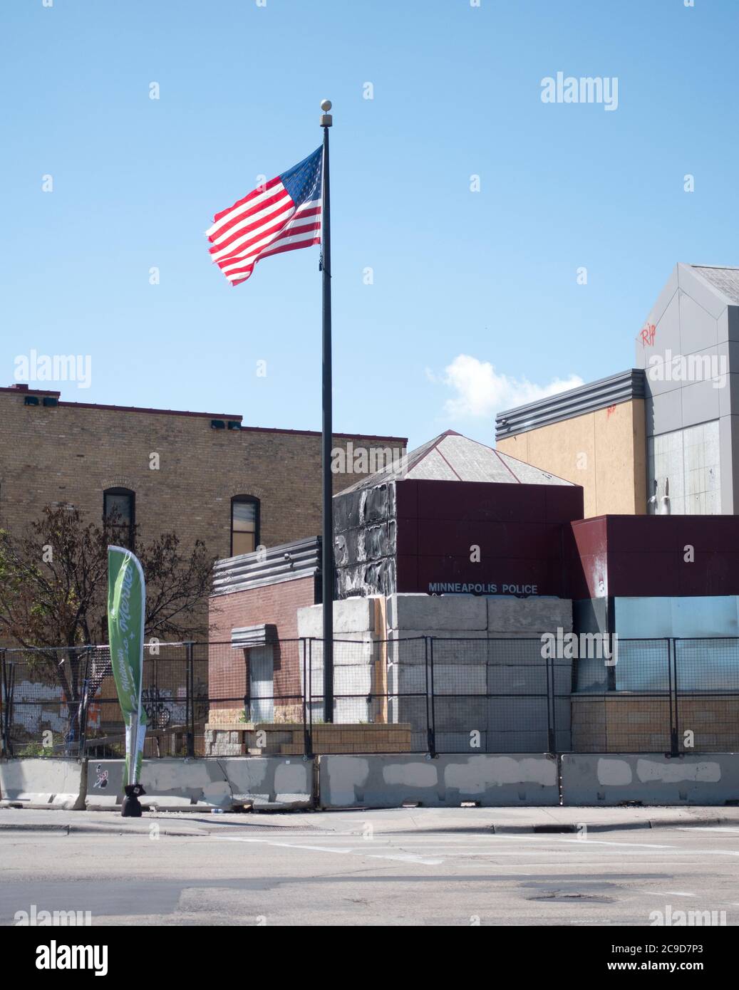 American flag flying over abandoned & burned 3rd Precinct Police ...