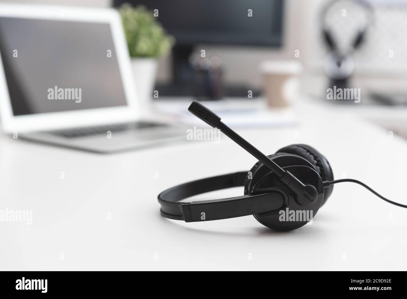 Headset in call center. Hotline support concept in office. Customer ...