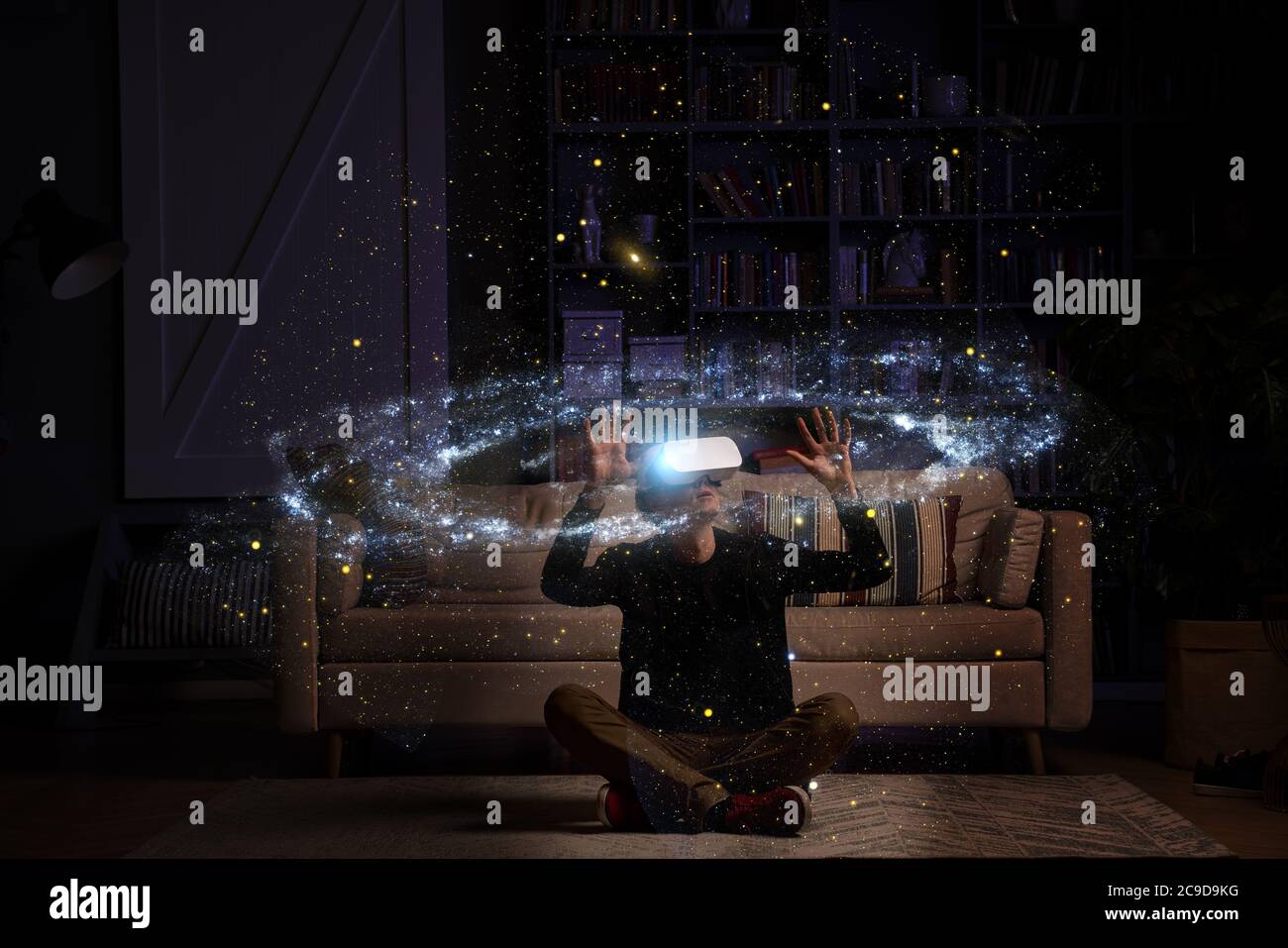 Man uses virtual reality glasses to see the galaxy space. Elements of ...