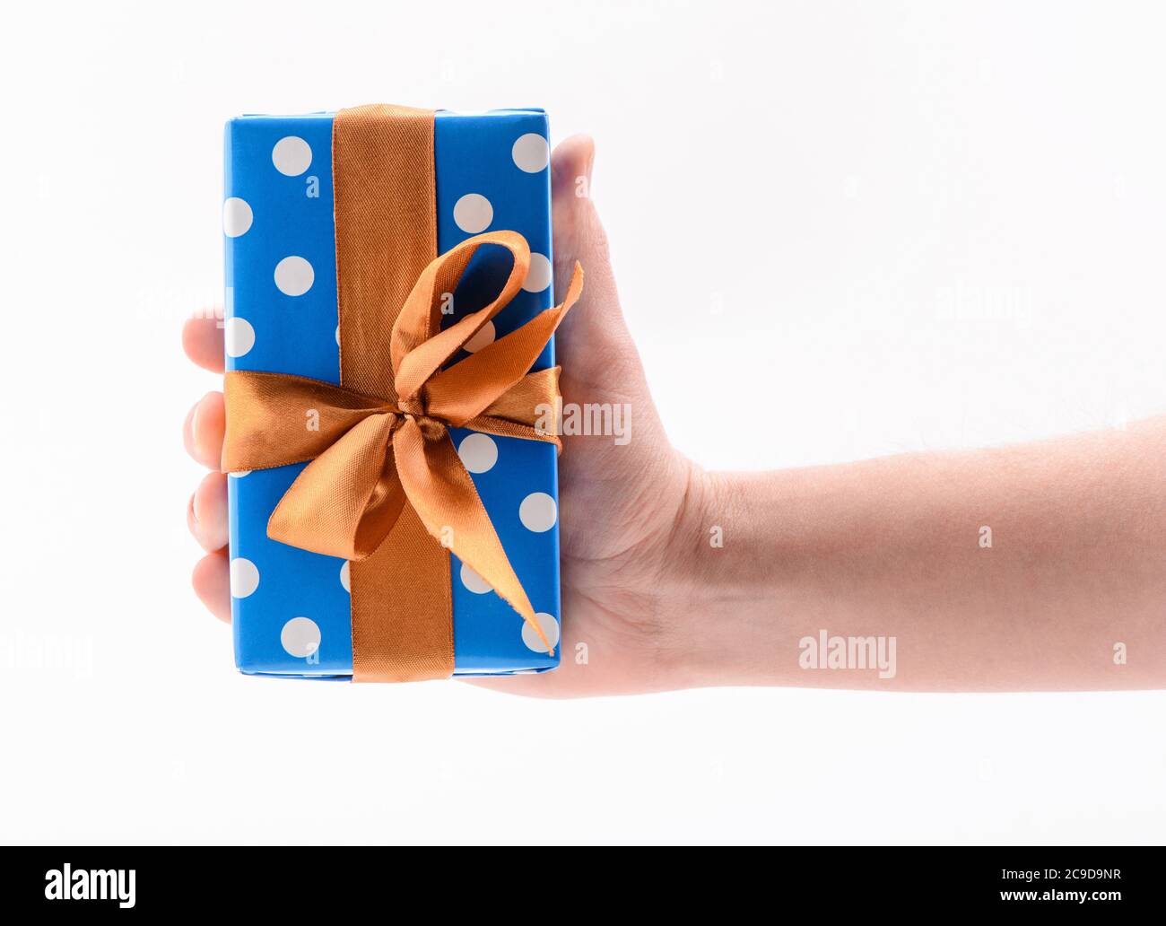 Hand holding a gift box, isolated on white Stock Photo - Alamy