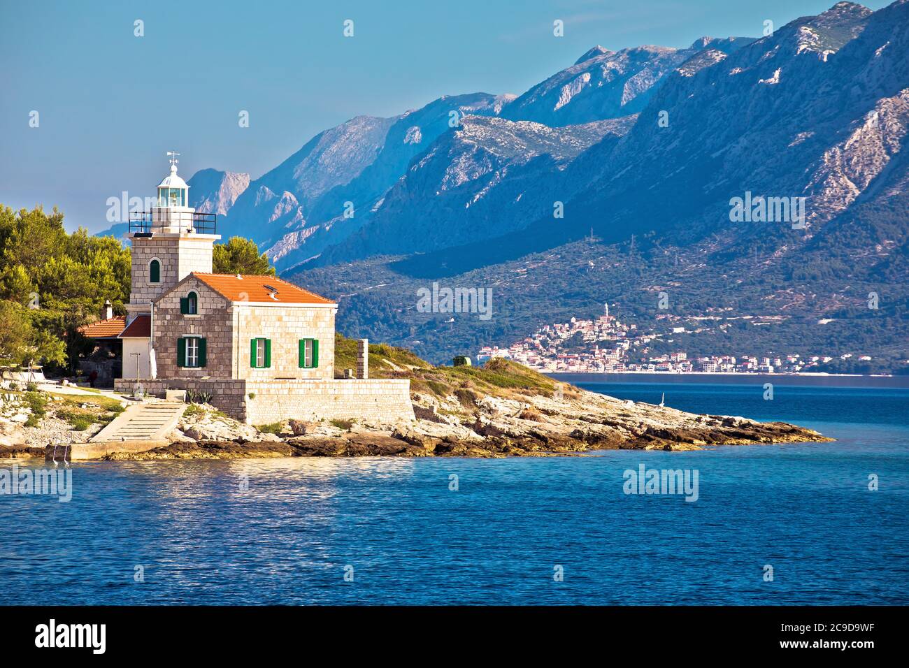 Lighthouse of Sucuraj on Hvar island and Biokovo mountain background ...