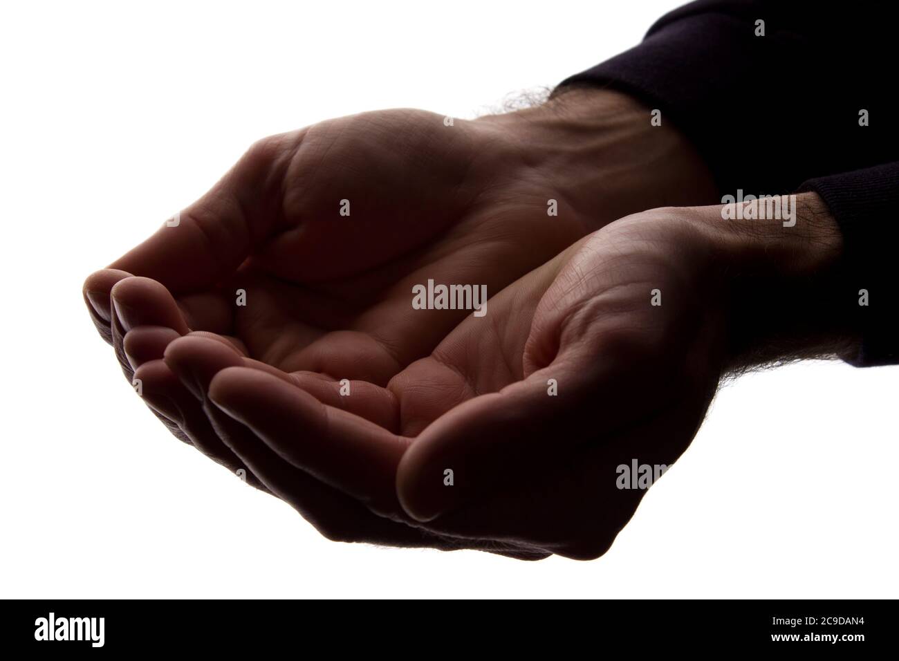 Two hands cupped together holding hi-res stock photography and images ...