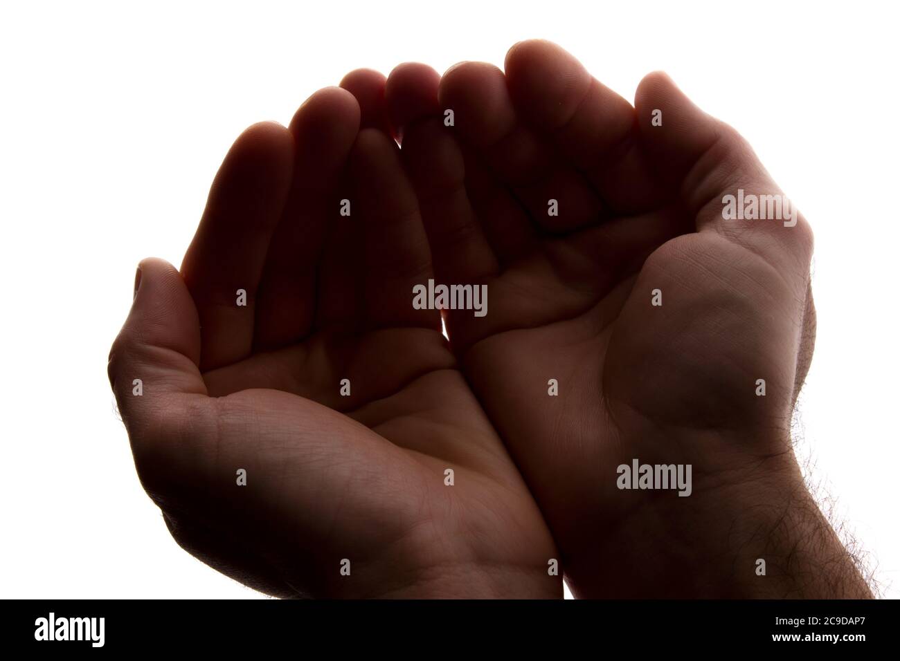 Two hands cupped together holding hi-res stock photography and images ...