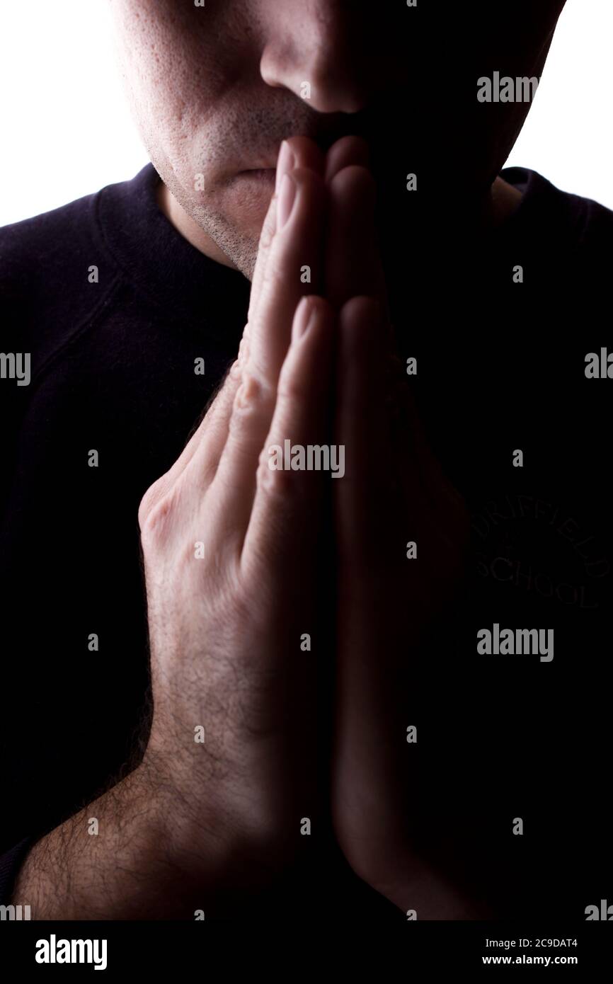 Man's hand together, prayer and request - silhouette, isolate Stock ...