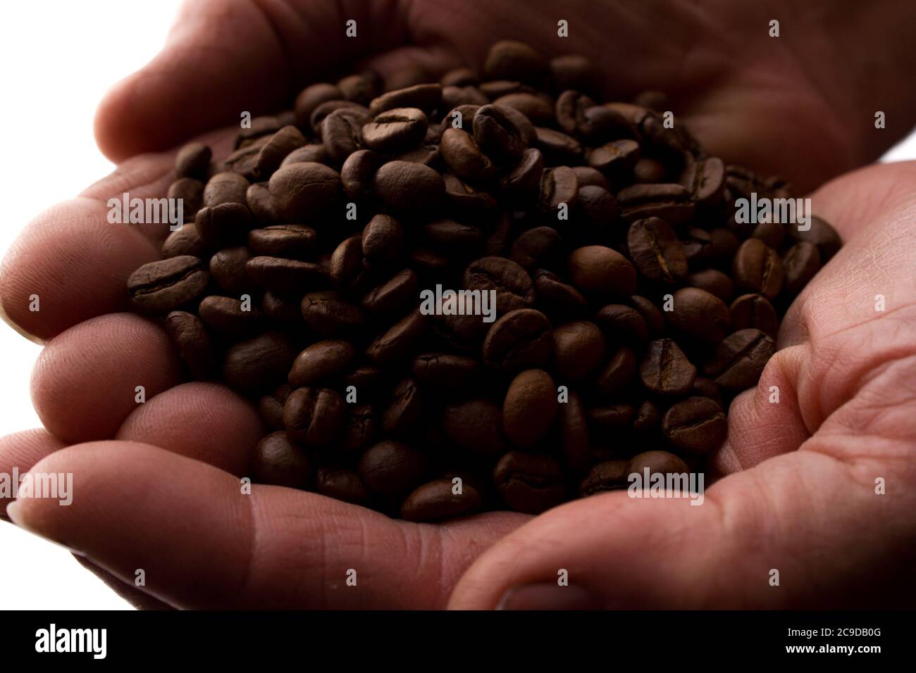 Mans hand handful coffee hi-res stock photography and images - Alamy