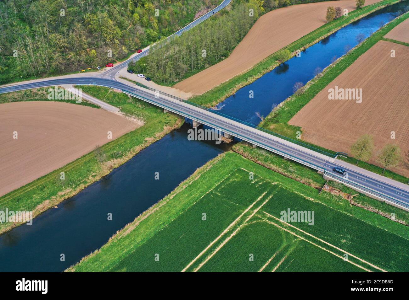 Aerial view of a road crossing a channel Stock Photo - Alamy