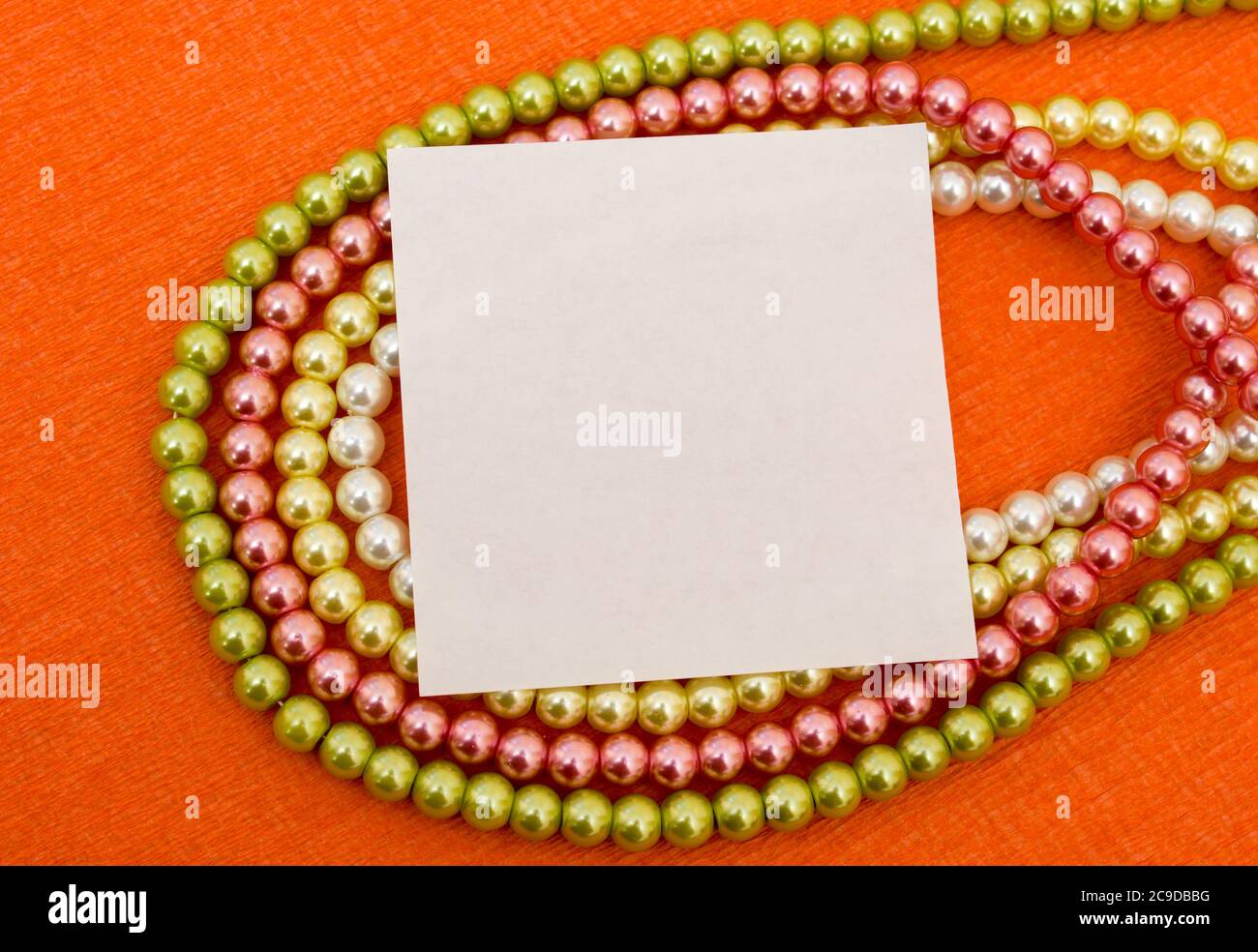 Bright multi-colored beads with a blank sheet of paper - frame ...
