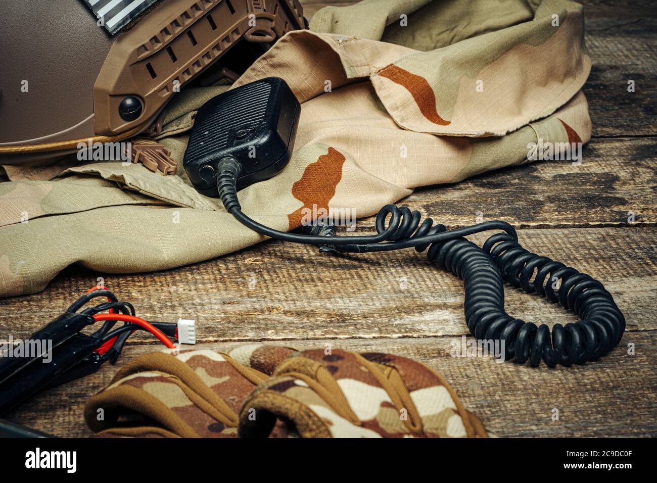 Military equipment, walkie-talkie with military uniform on wooden board ...