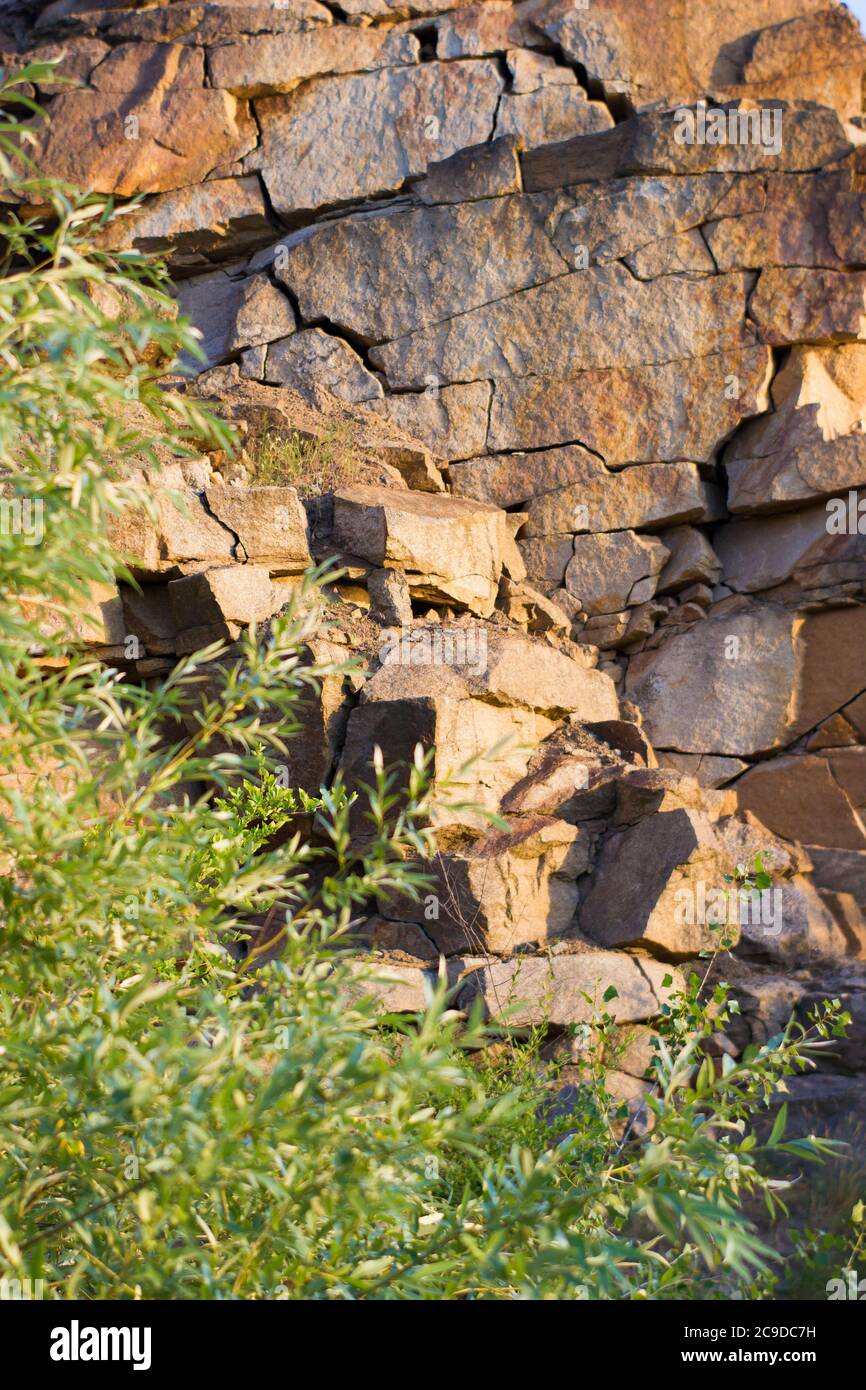 Texture of a large granite rock made of stones - marble stone quarry ...