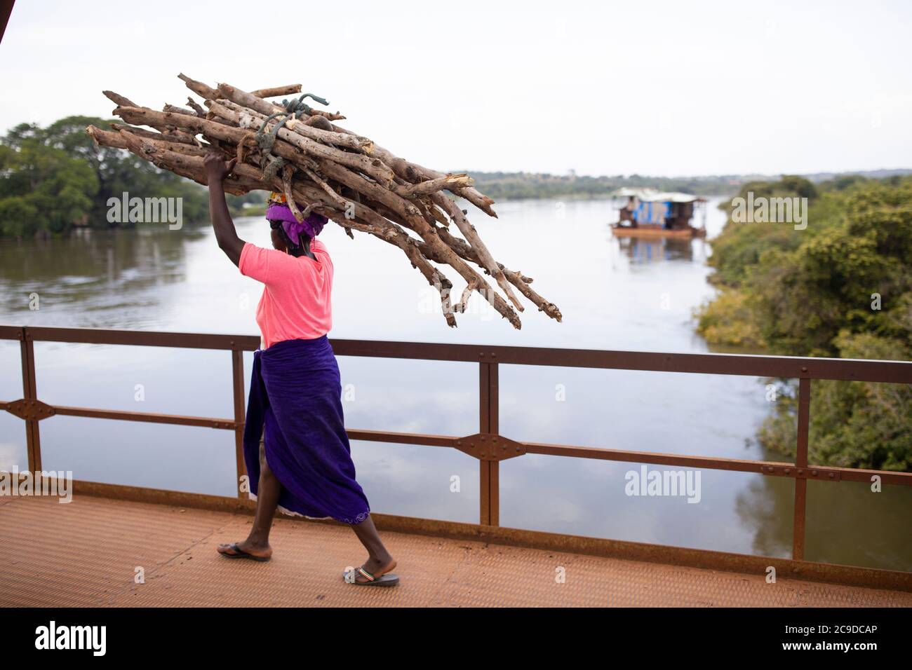 Residents traverse a bridge over the Niger River, Africa’s third ...