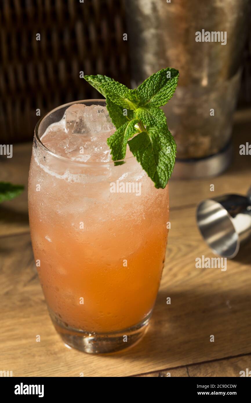 Refreshing Sweet Planters Punch Tiki Cocktail with Mint Stock Photo - Alamy
