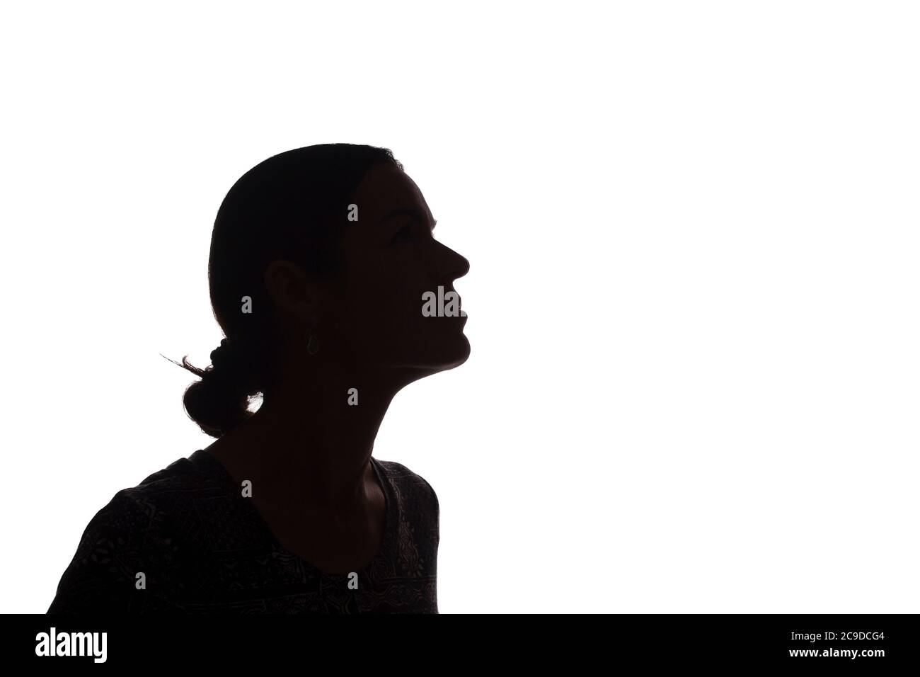 Portrait of a young woman, pensive, thinking side view - silhouette ...