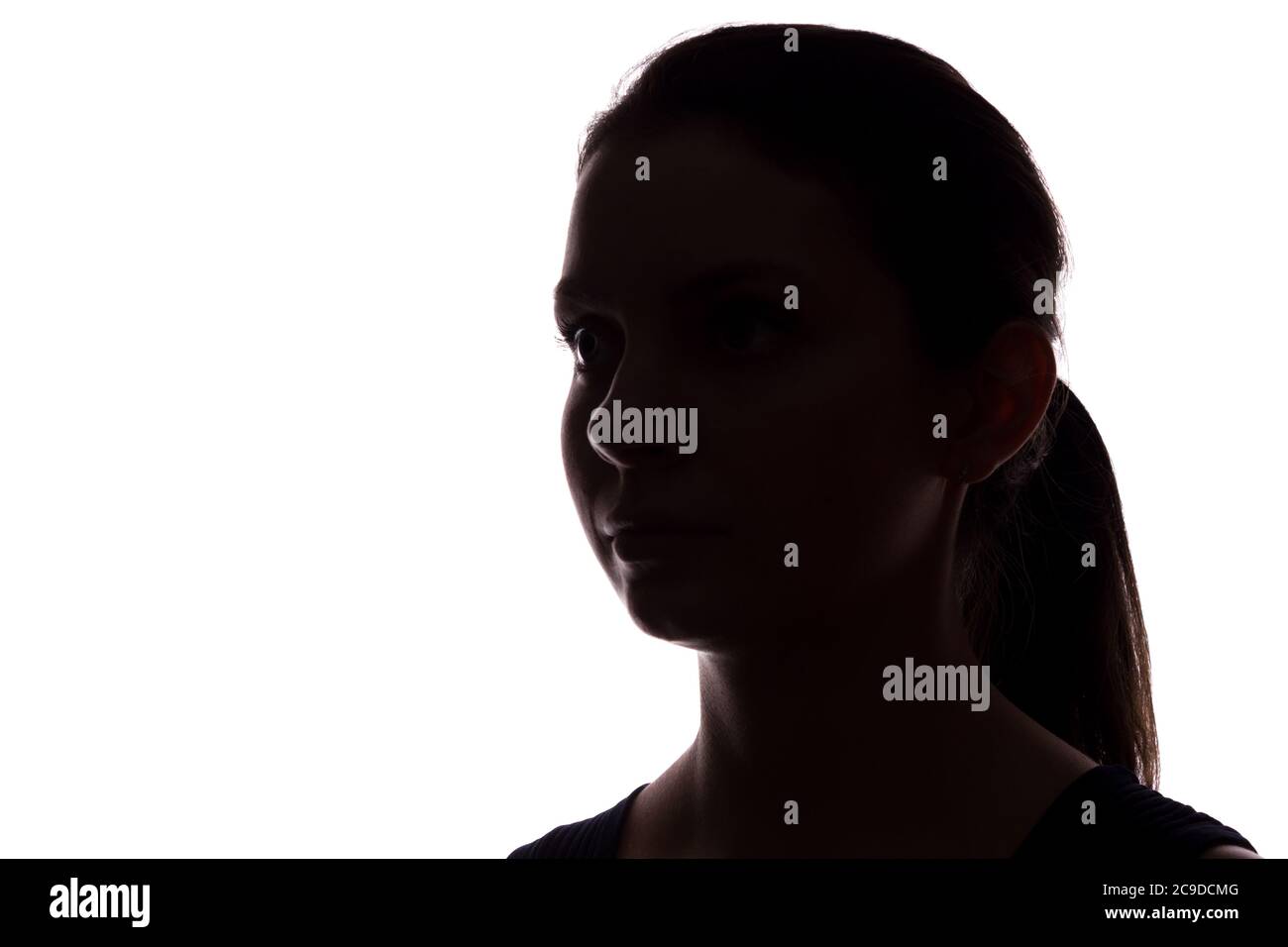 Young woman look ahead with flowing hair - horizontal silhouette of a ...