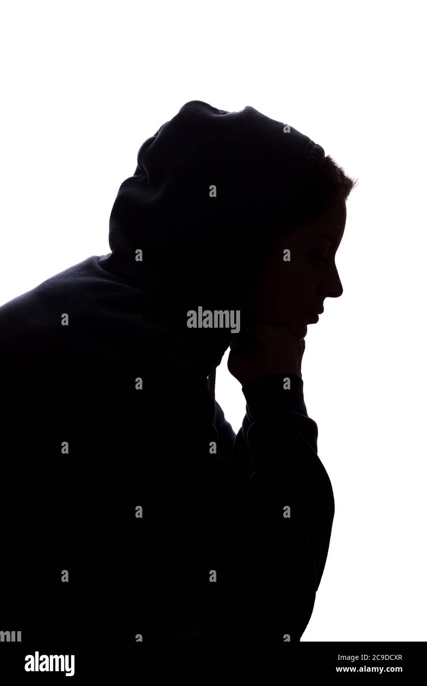 Young woman with grief dropped his arms - silhouette Stock Photo - Alamy