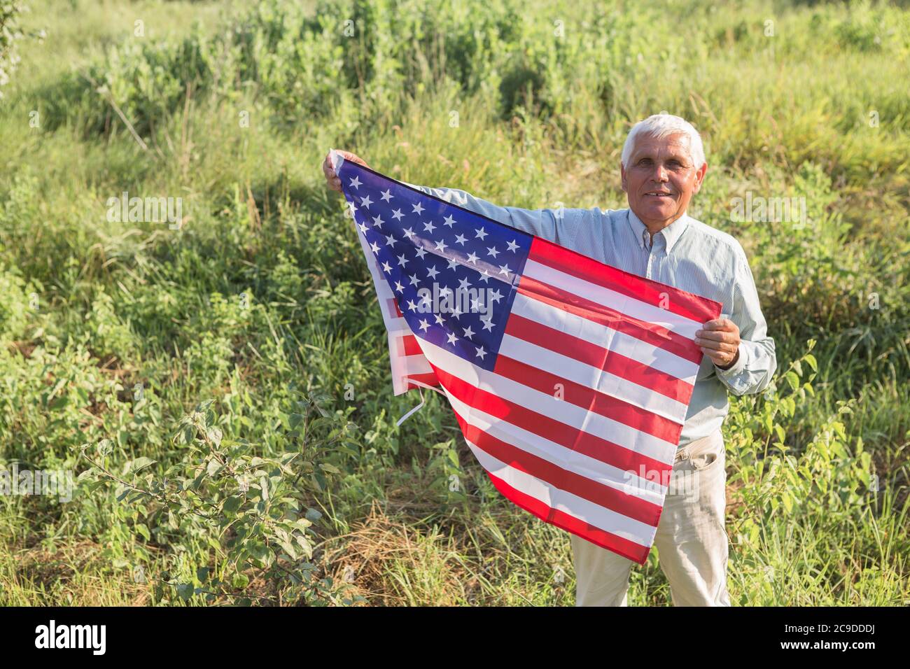 Patriotic senior man celebrates usa independence day on 4th of July ...