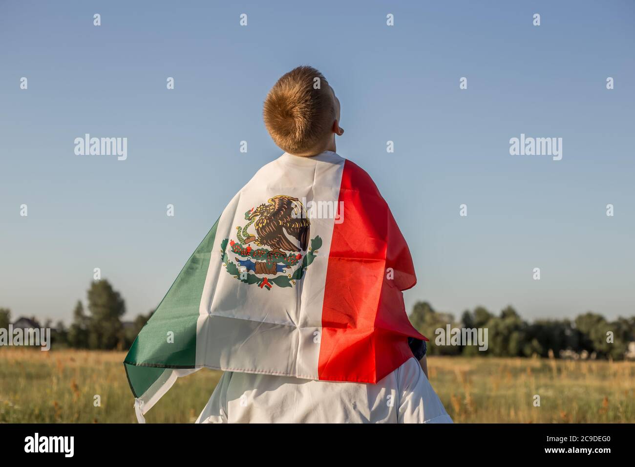 Young boy holding flag of Mexico. "September 16. Independence Day of ...