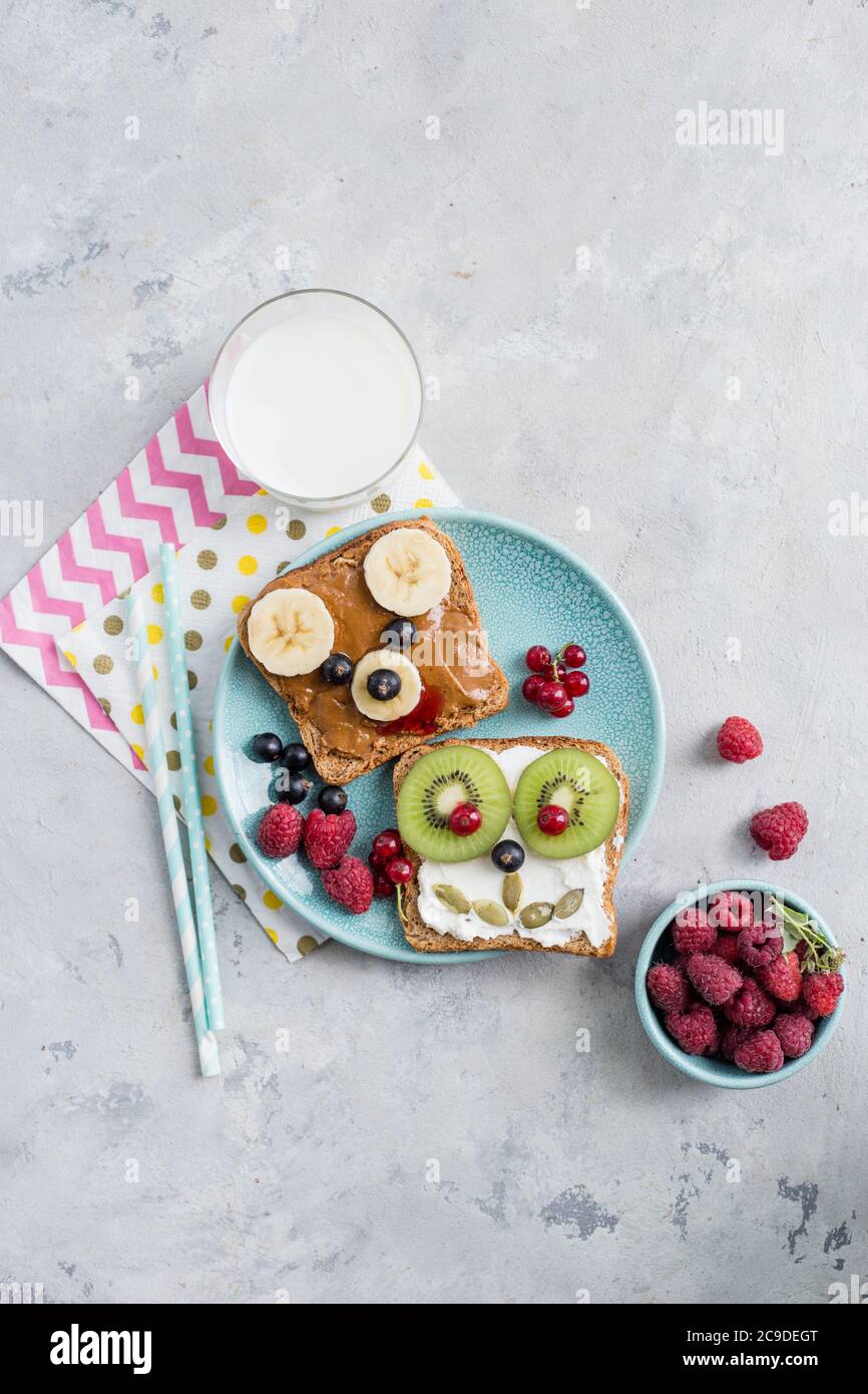 Funny breakfast toast for kids shaped as cute dog, bear. Food art ...