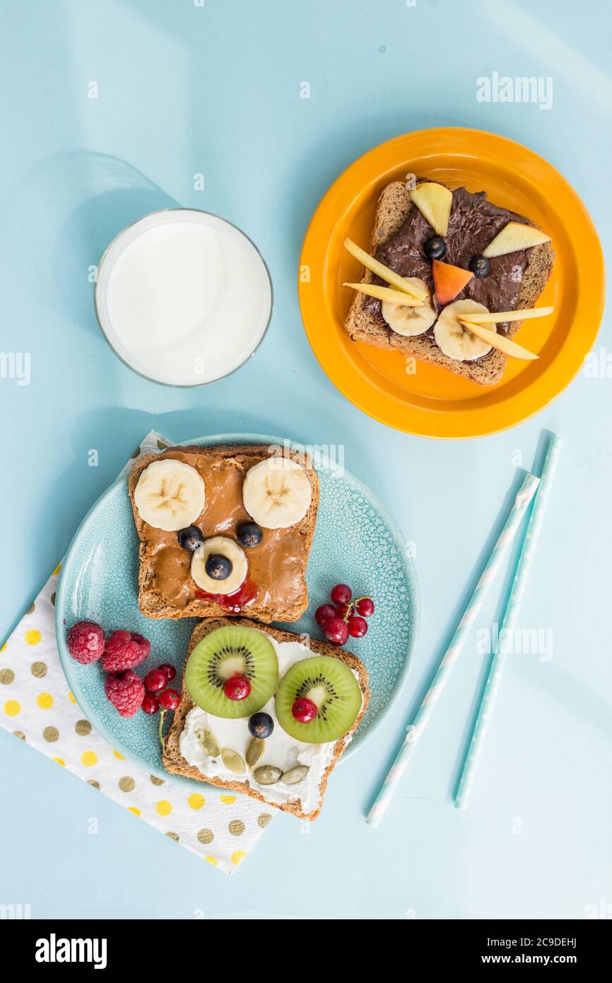 Funny breakfast toast for kids shaped as cute cat, dog, bear, fish ...