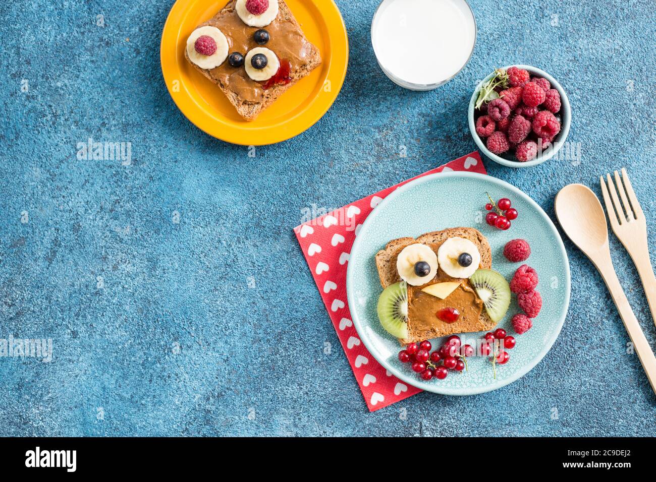 Funny breakfast toast for kids shaped as cute owl, dog. Food art ...