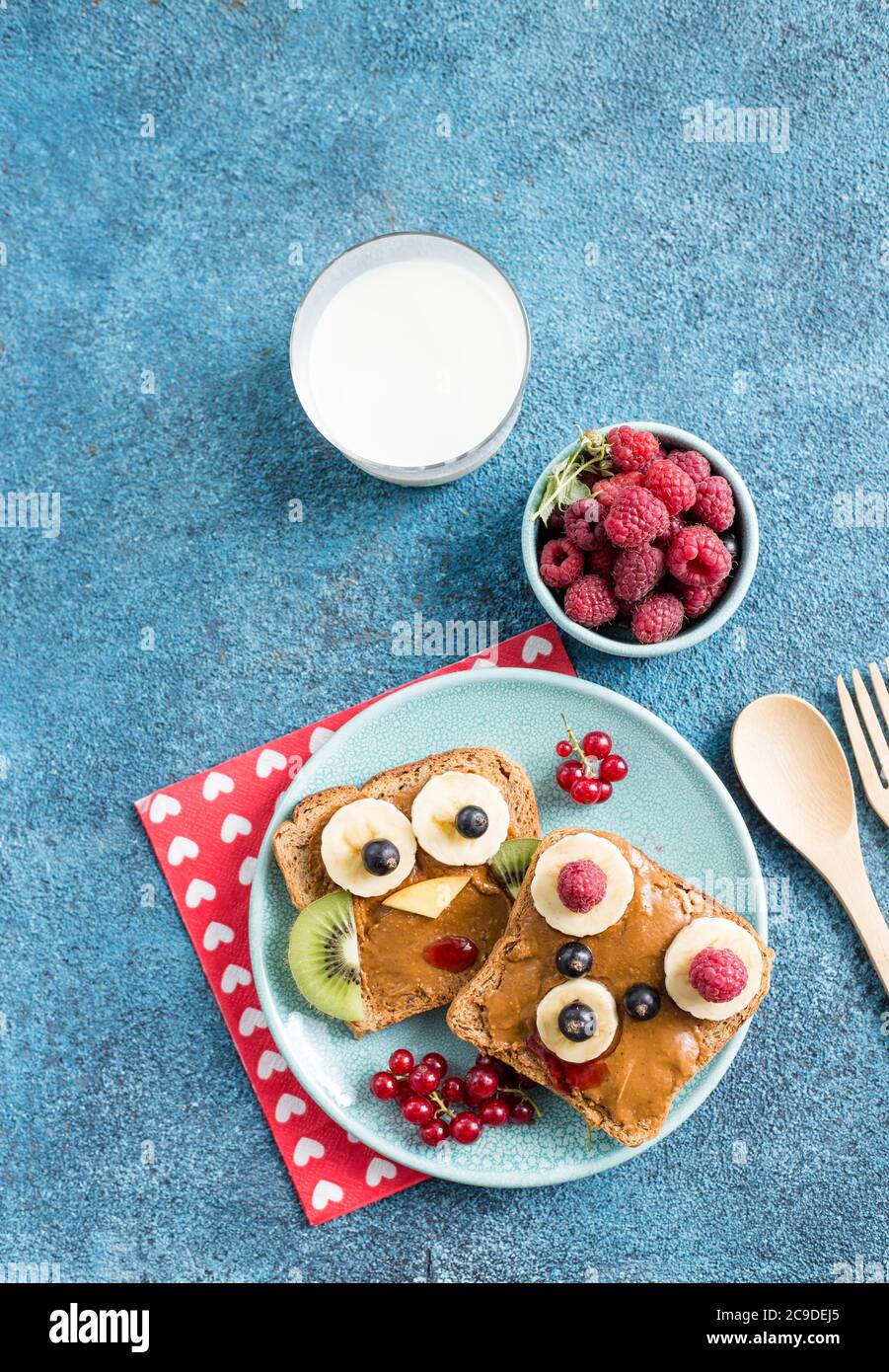 Funny breakfast toast for kids shaped as cute owl, dog. Food art ...