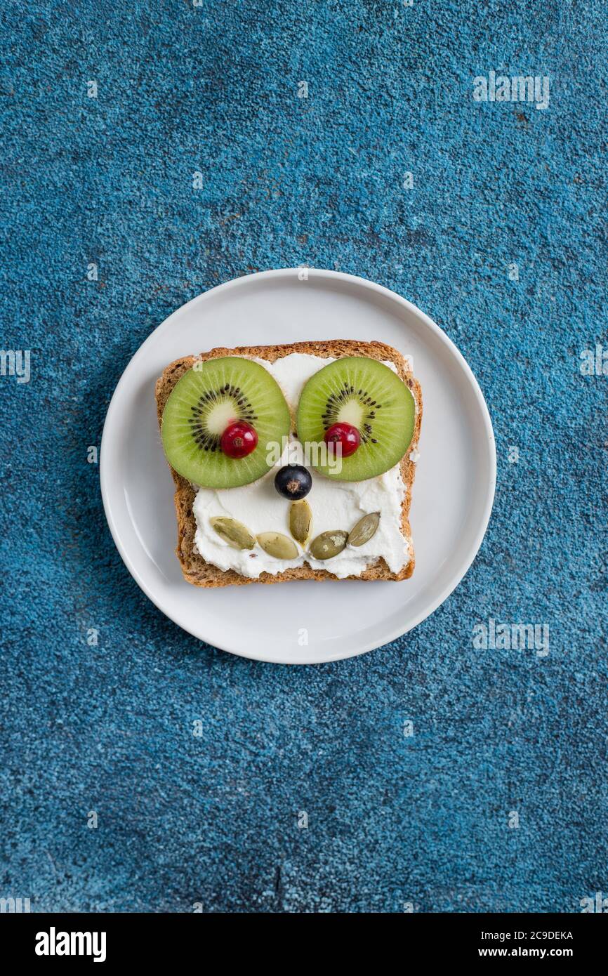 Funny breakfast toast for kids shaped as cute dog. Food art sandwich ...