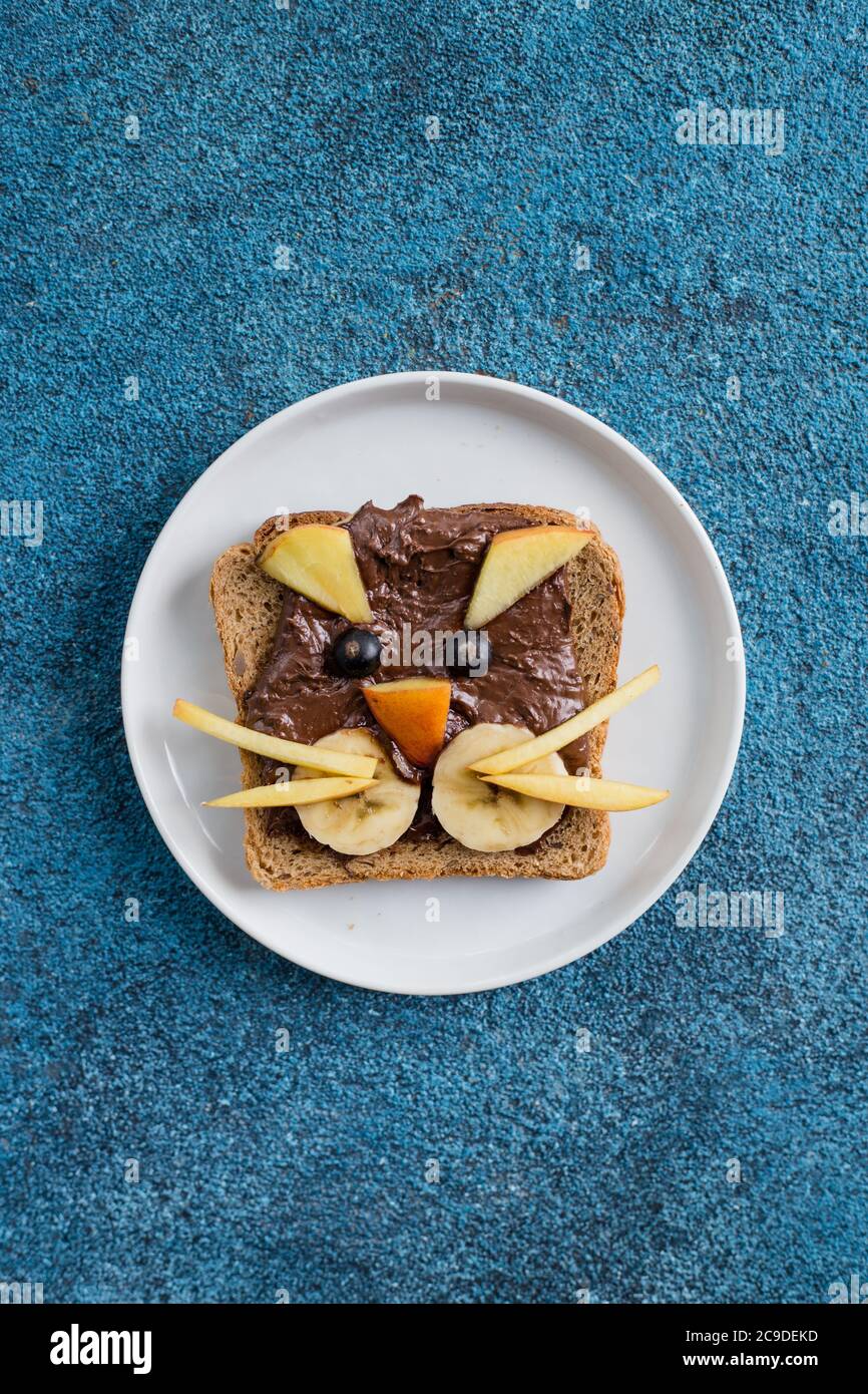 Funny breakfast toast for kids shaped as cute cat. Food art sandwich ...