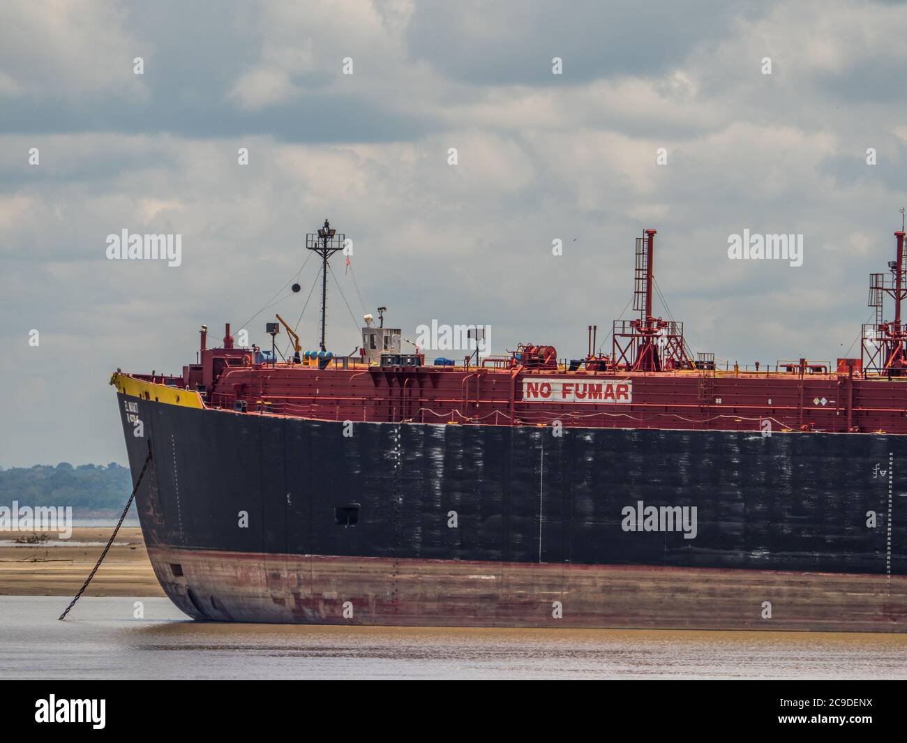 Oceanic ship and local boat on the Amazon River over 3,000 km from the ...