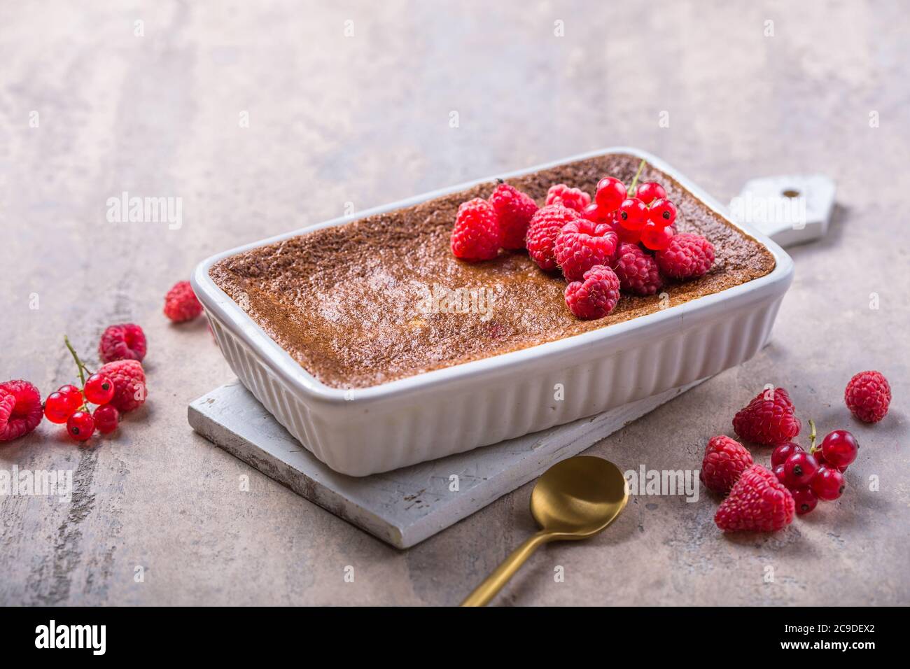 Rice pudding. French milk rice dessert with raspberries Stock Photo - Alamy