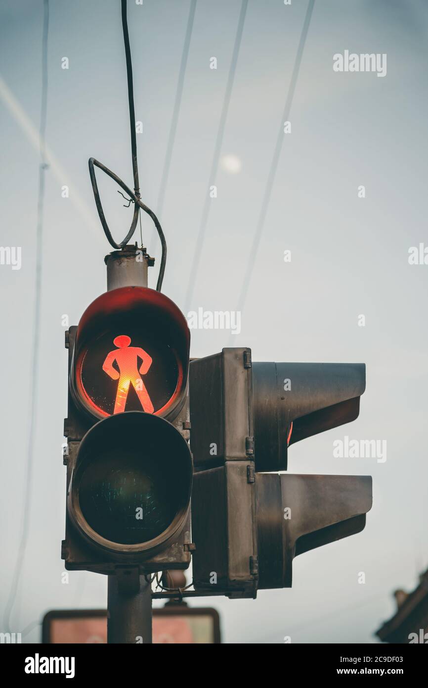 Red traffic light for pedestrians. Retro filtered Stock Photo - Alamy