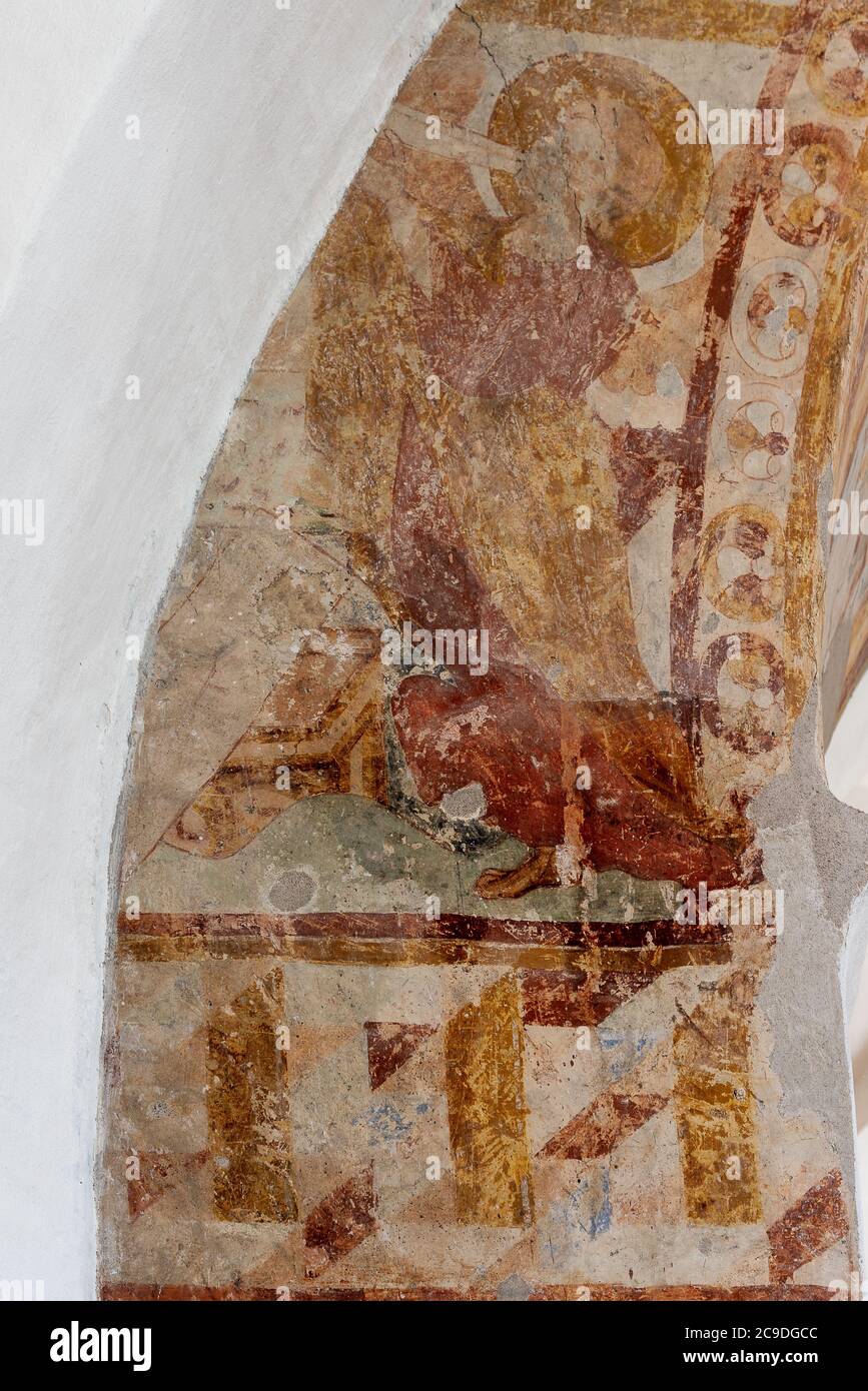 Angel blowing a trumpet on the Day of Judgement, Romanesque wall ...