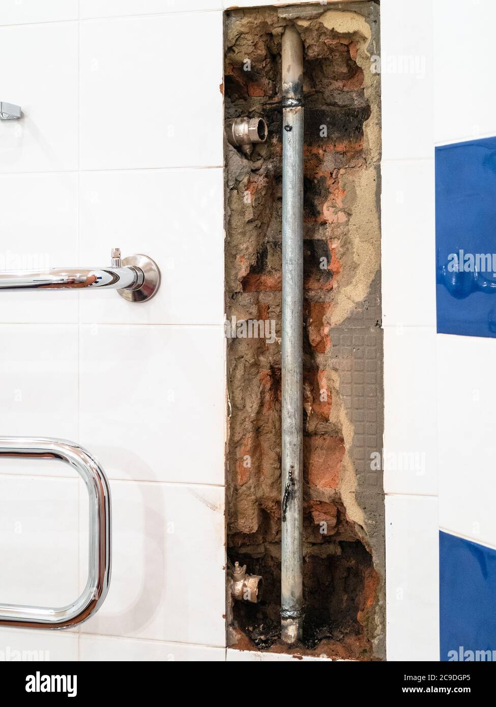 repairing of plumbing riser of heated towel rail at home - piece of new ...