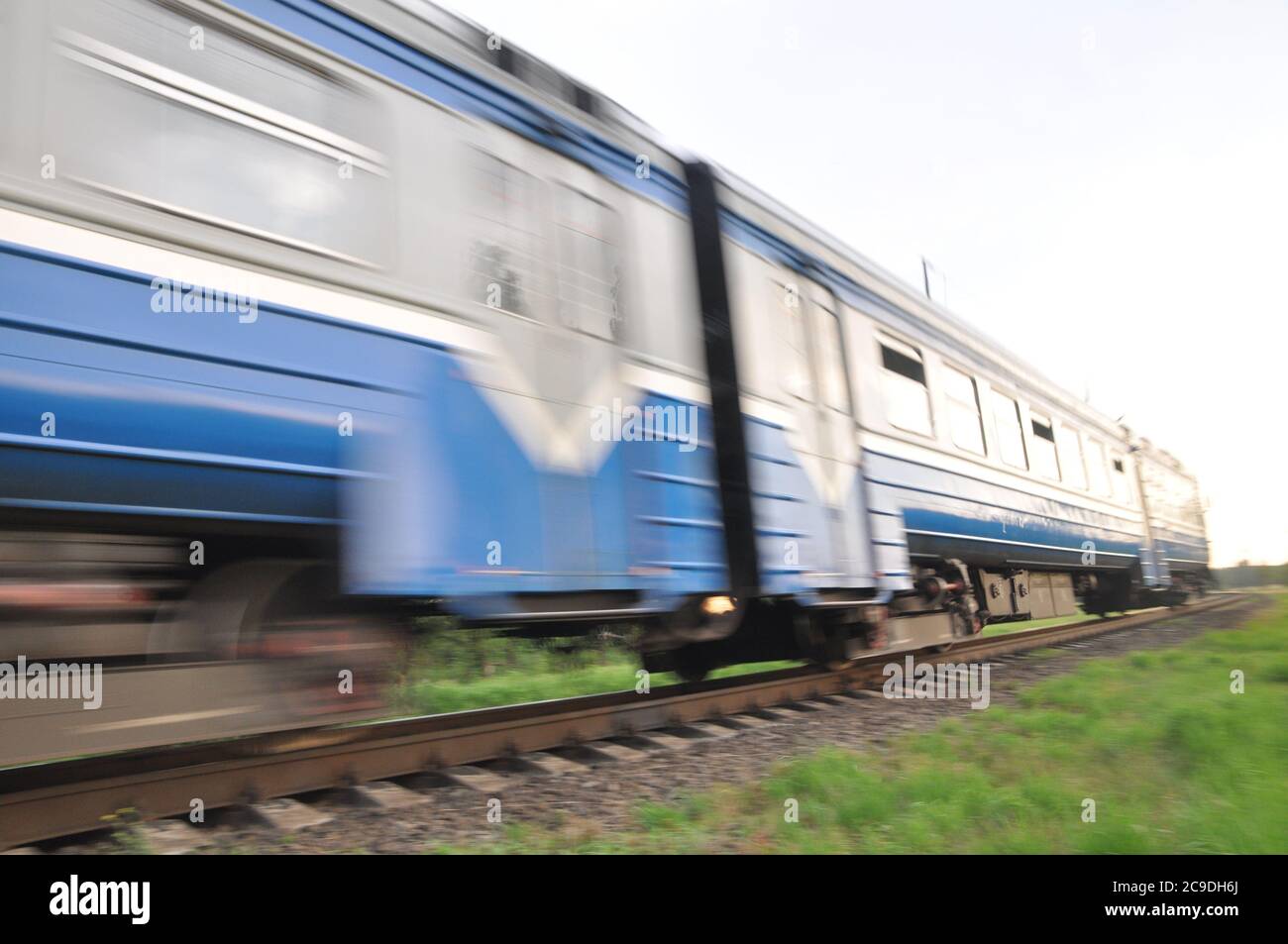 A high-speed diesel train moves quickly by rail. Blur Stock Photo - Alamy