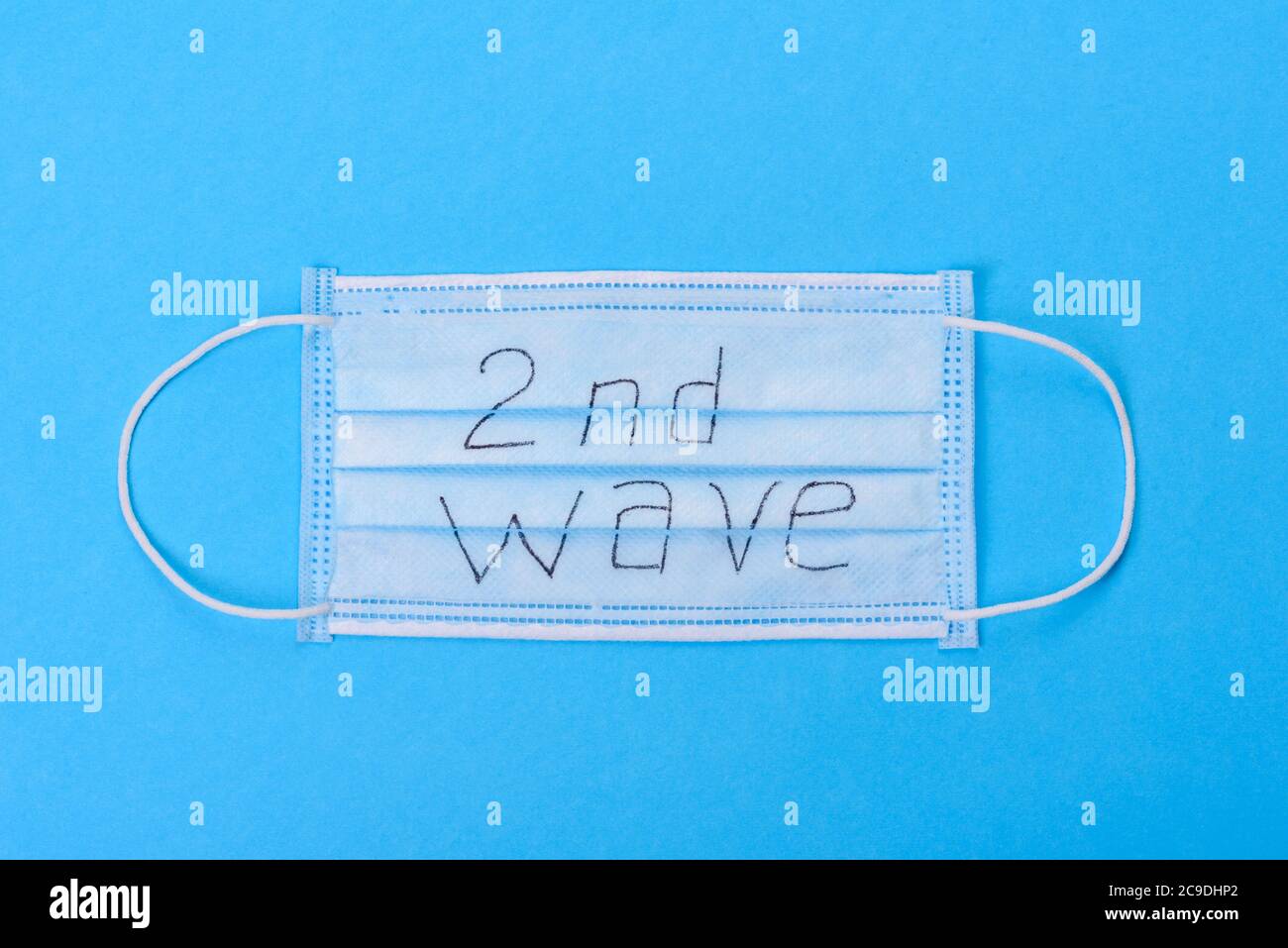 Covid 19 second wave. Covid 19. Medical mask on colors background and ...
